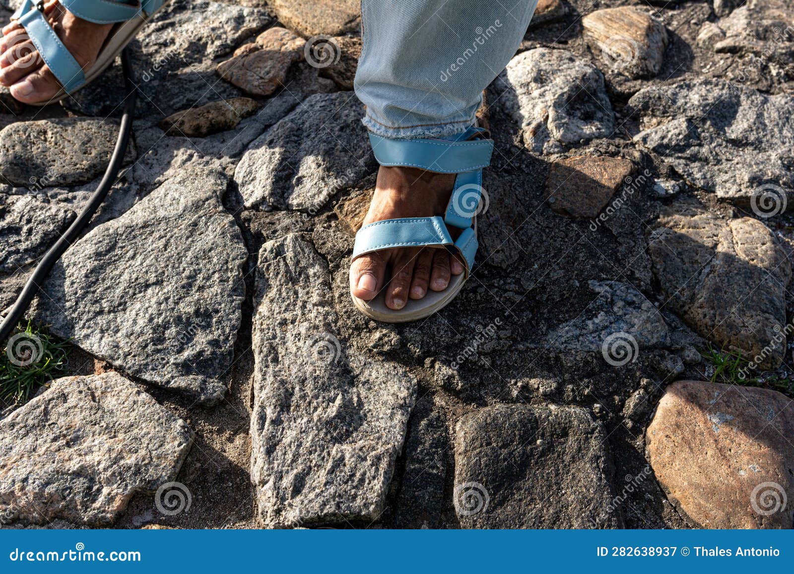 Texture of Stones on the Ground. a Human Foot Treads the Ground Stock ...