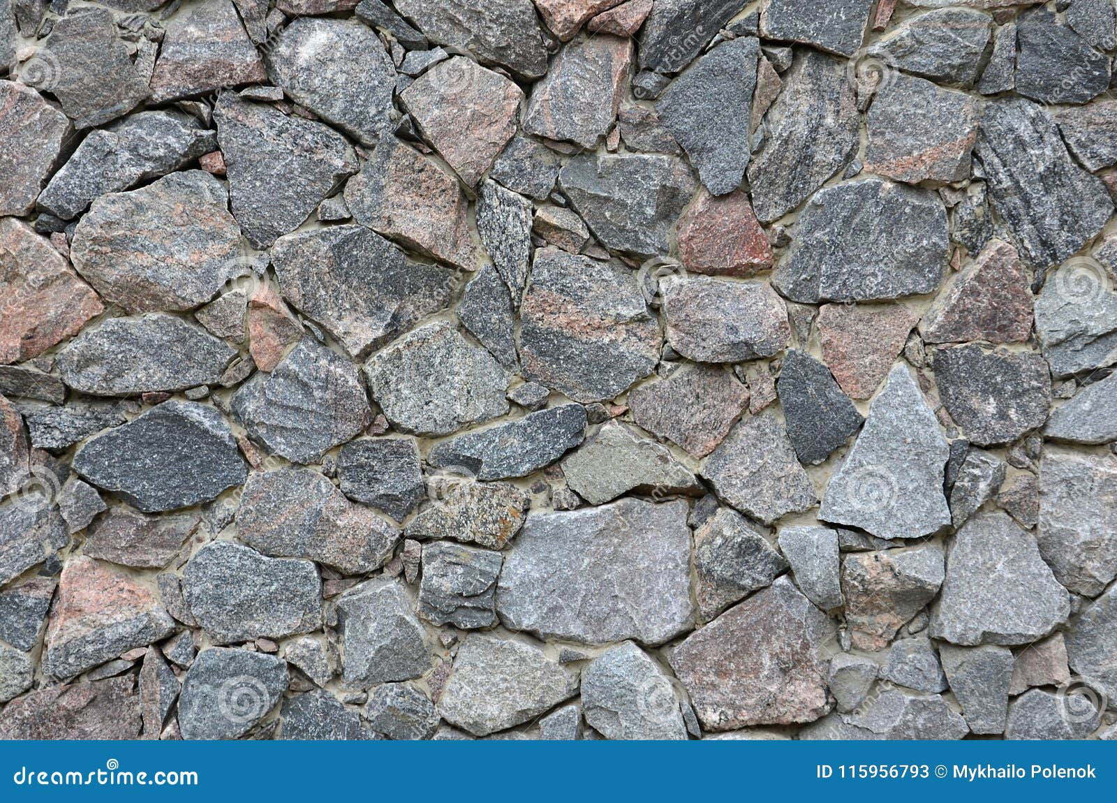 The Texture of a Strong Stone Wall of Many Concreted Stones of Various ...