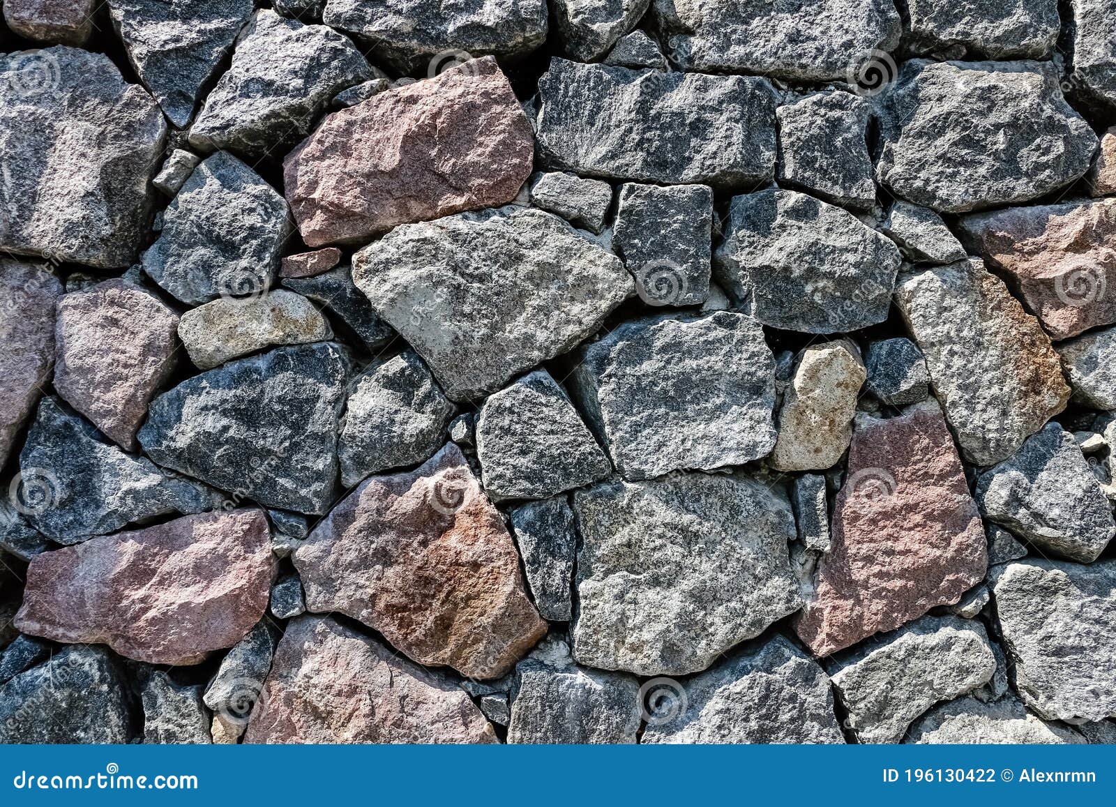 A Wall of Heaped Stones of Different Sizes and Shapes. Stock Photo ...