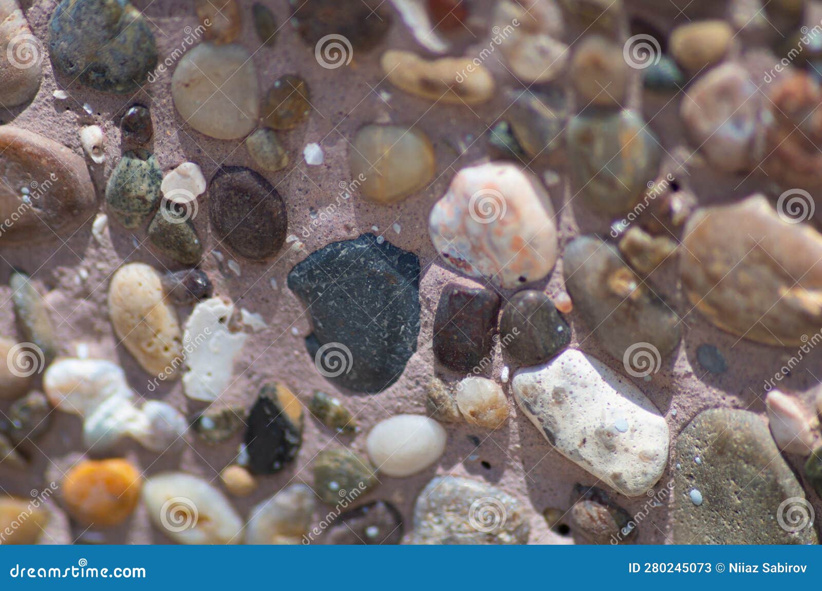 The Texture Of The Wall With Multi-colored Stones Of Different Sizes ...