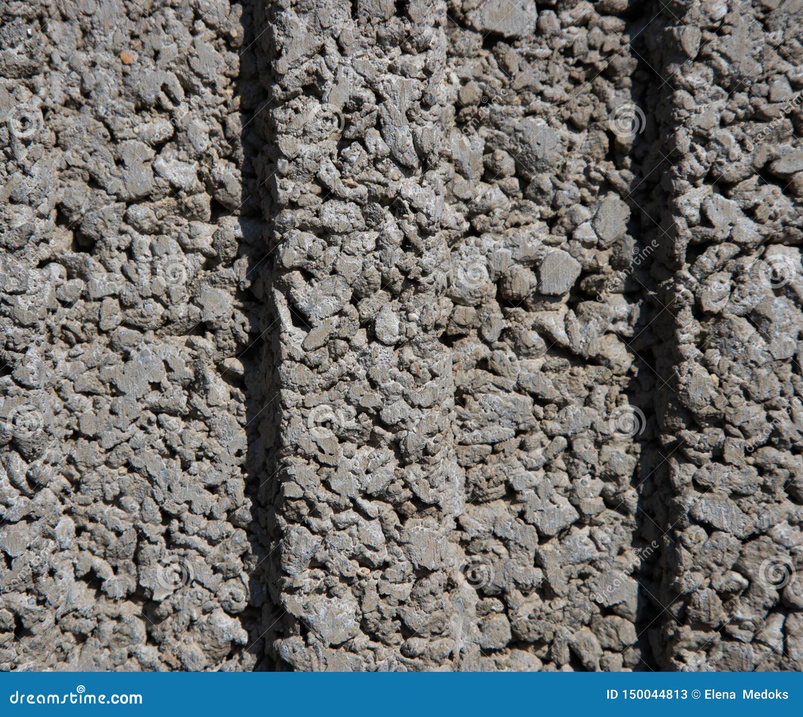 Texture of a Wall of Small, Small Gray Stones with Two Dimples in the ...