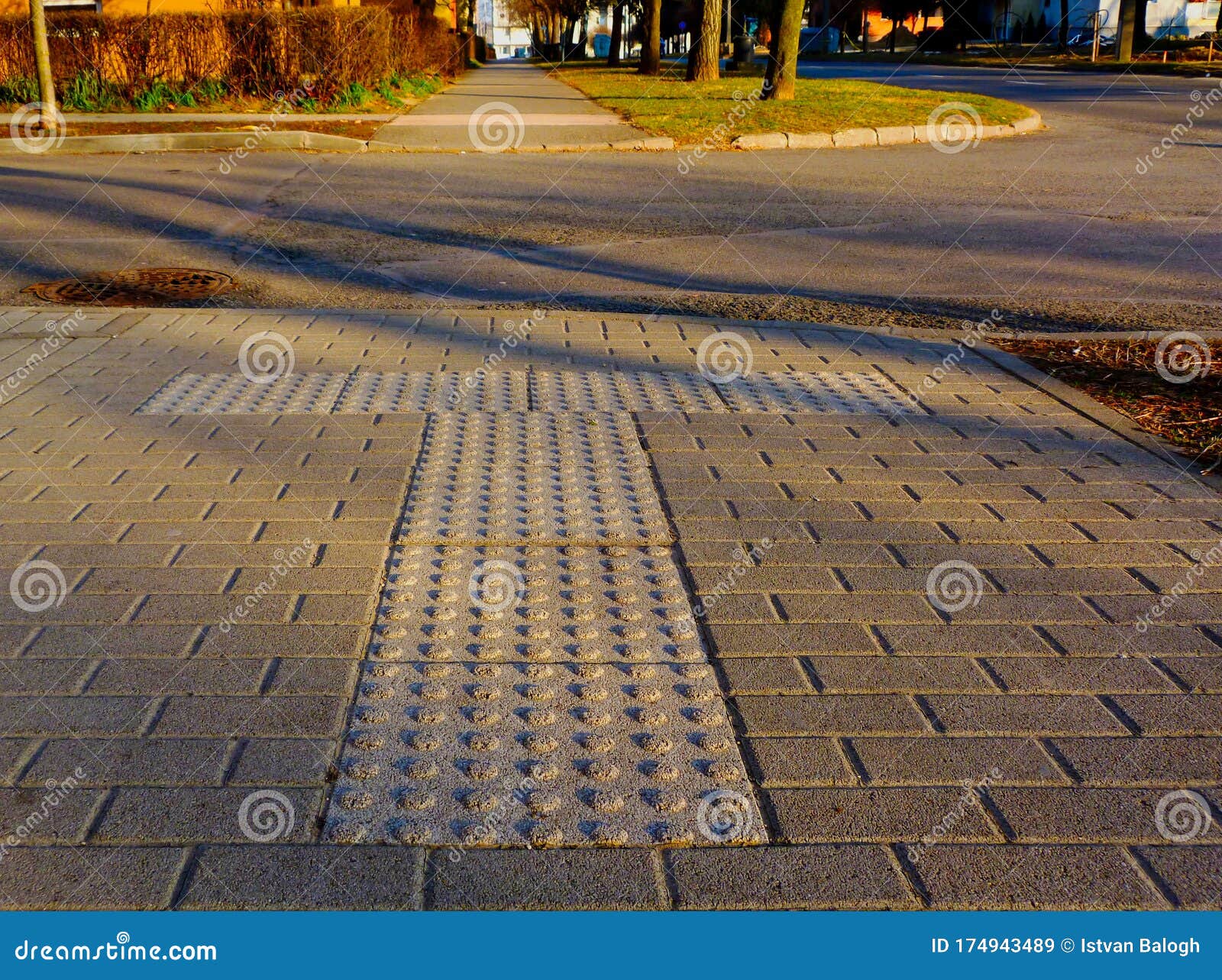 Textured Bumpy Section of Concrete Sidewalk Nearing Street Intersection ...