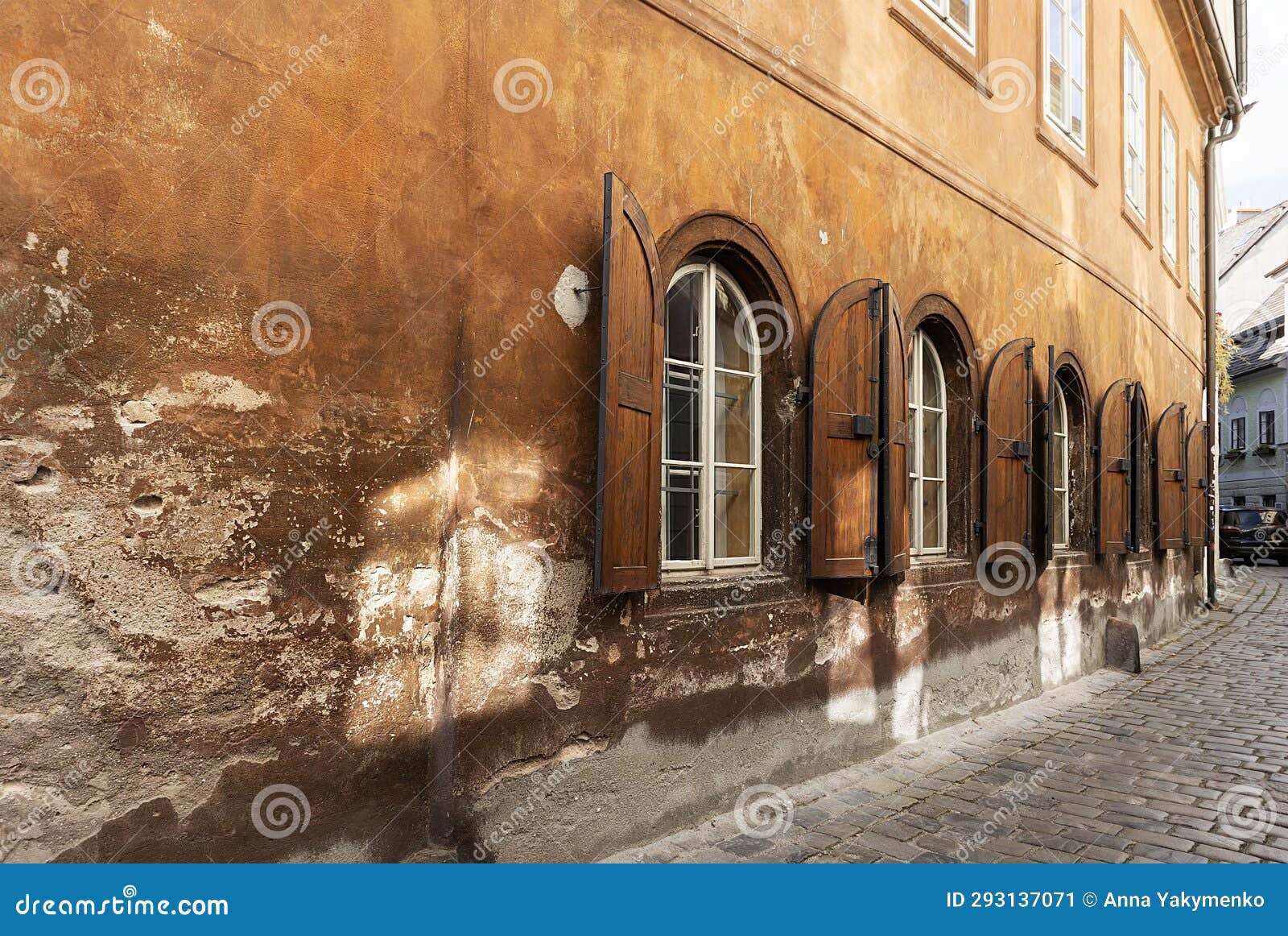 Textured Ginger Wall of an Old House with Shutters on Windows Stock ...