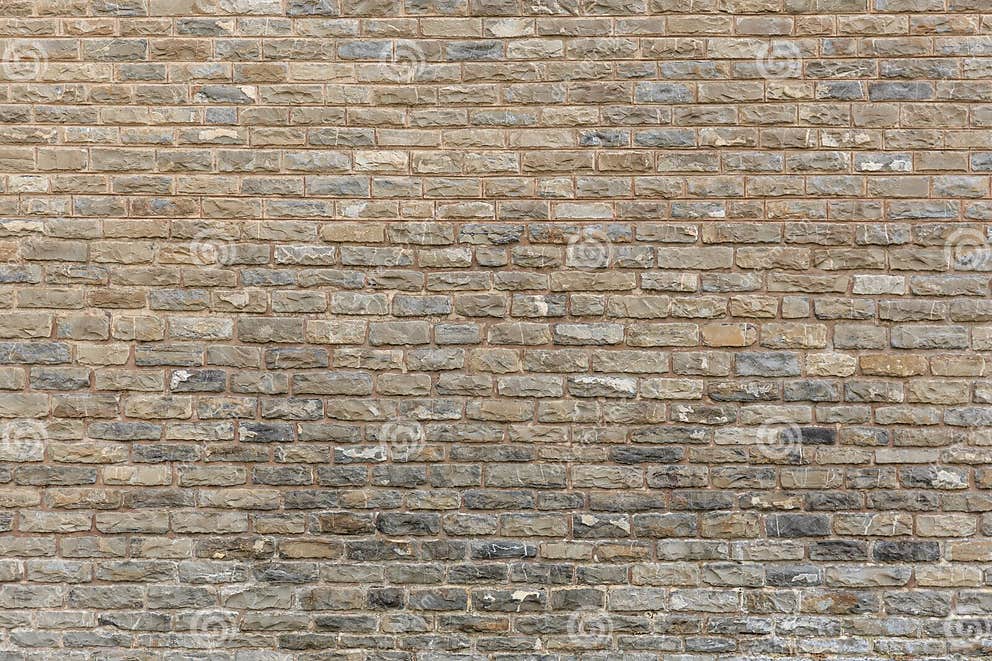Textured Gray and Brown Brick Wall with Varied Stone Patterns Stock ...