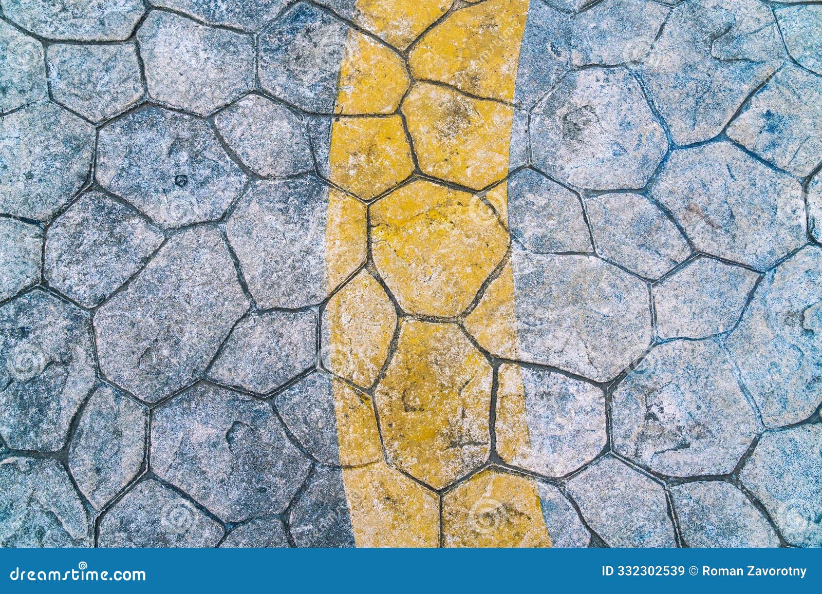 Textured Pavement with a Yellow Line Running through Hexagonal Stones ...