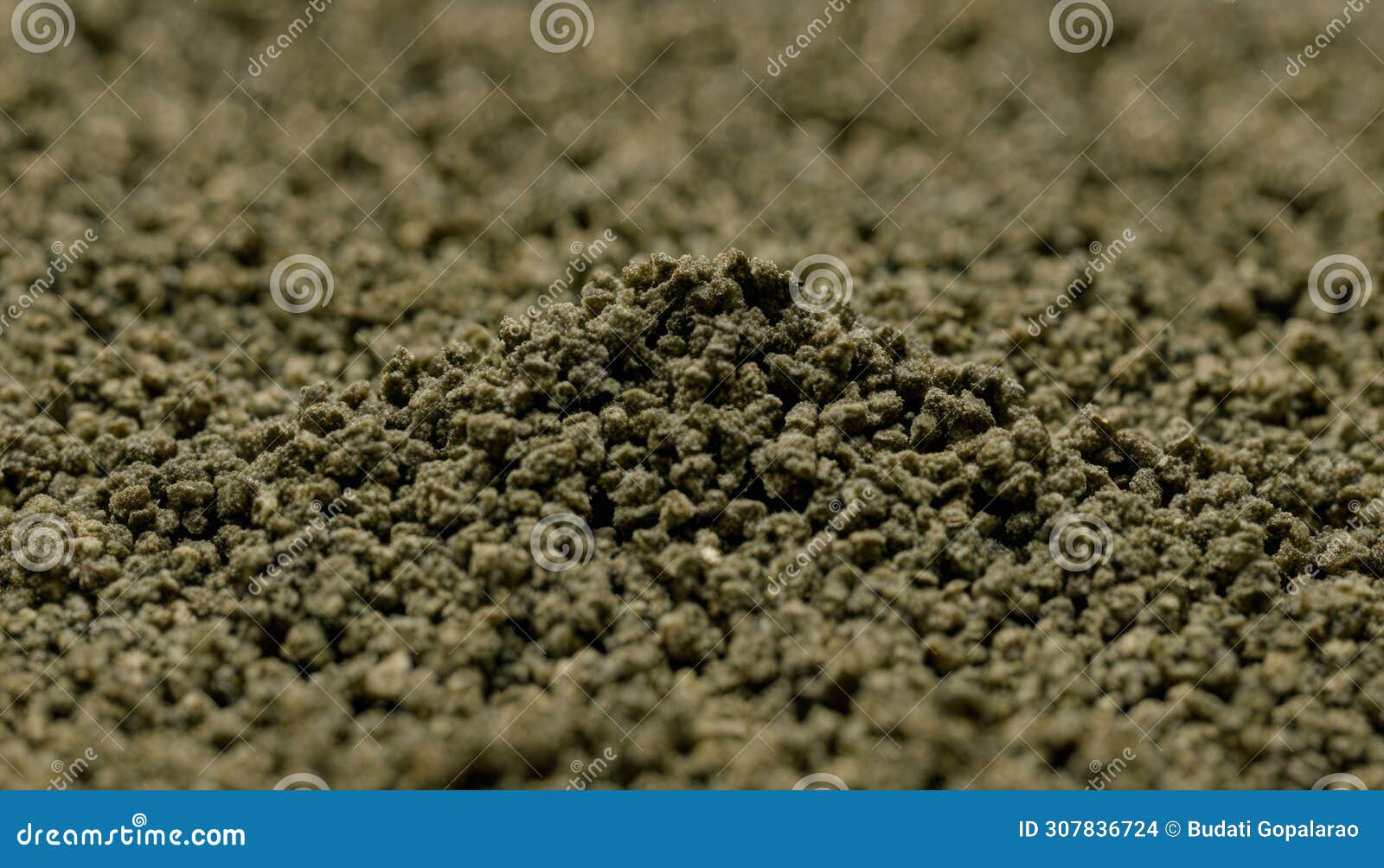 Textured Surface with a Small Mound of Granular Material Stock Photo ...
