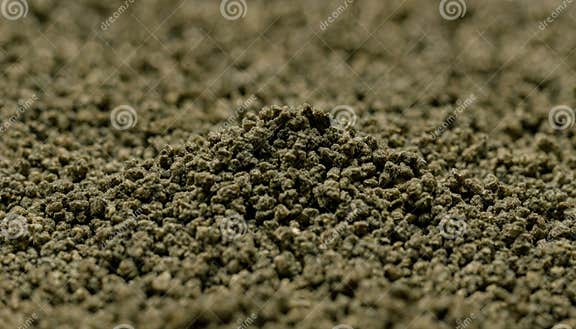 Textured Surface with a Small Mound of Granular Material Stock Photo ...
