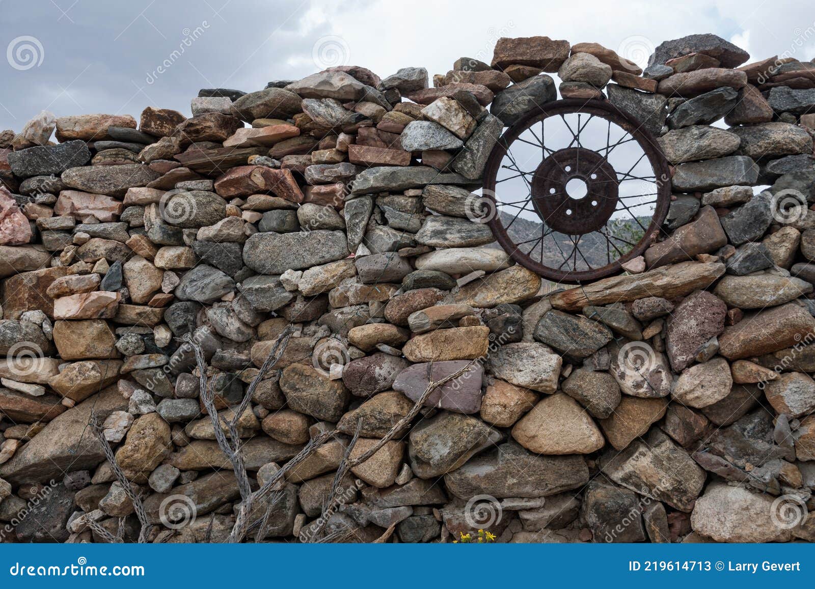 Textures and a Wheel, Rock Wall Stock Image - Image of artistic, joints ...