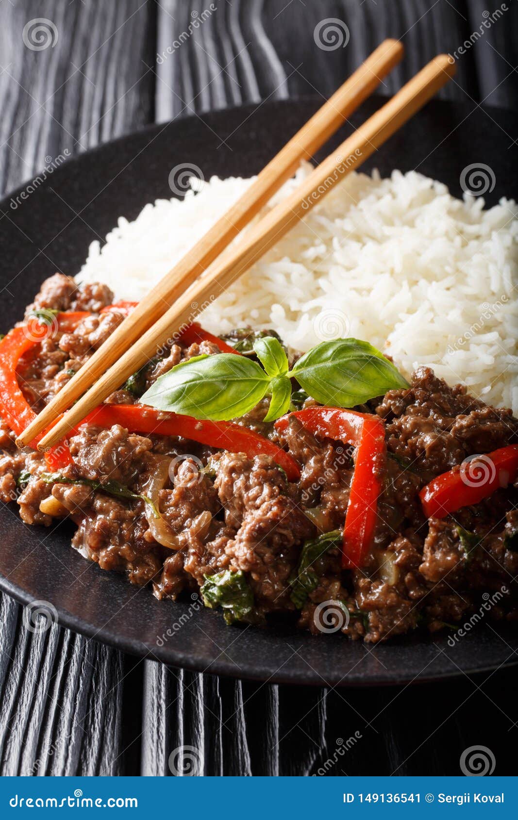 Thai Basil Beef, or Pad Gra Prow with Rice Side Dish Close-up. Vertical ...