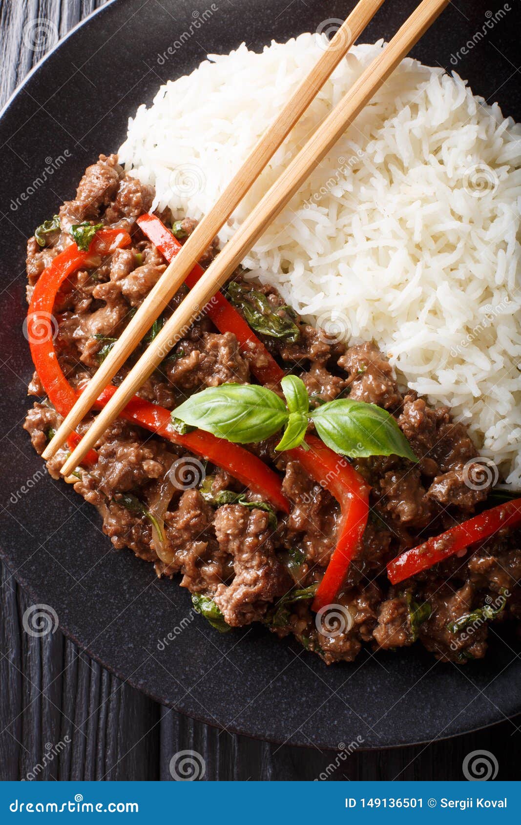 Thai Basil Beef, or Pad Gra Prow with Rice Side Dish Close-up. Vertical ...