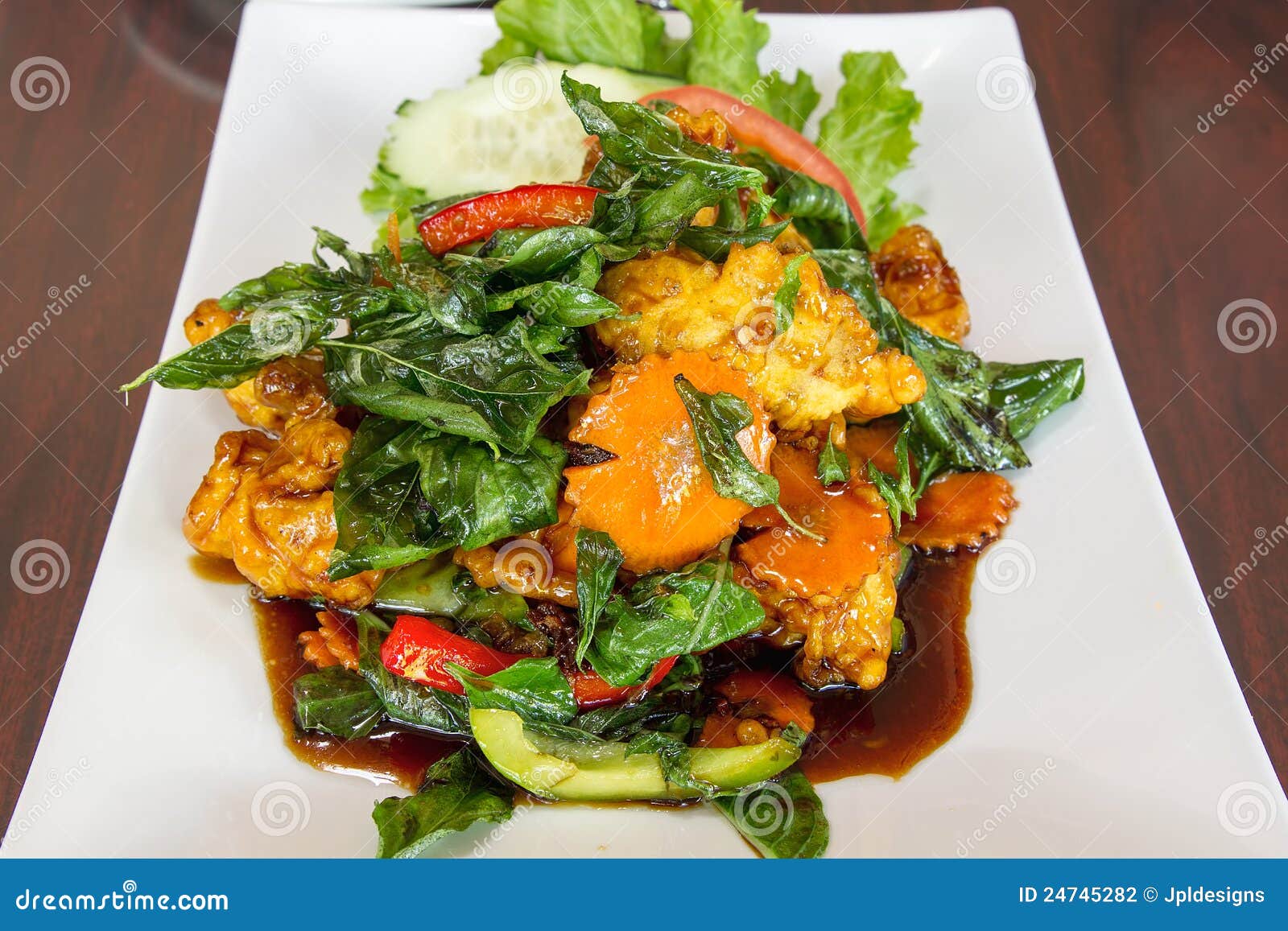 Thai Crispy Chicken with Basil Leaves Vertical Stock Photo - Image of ...