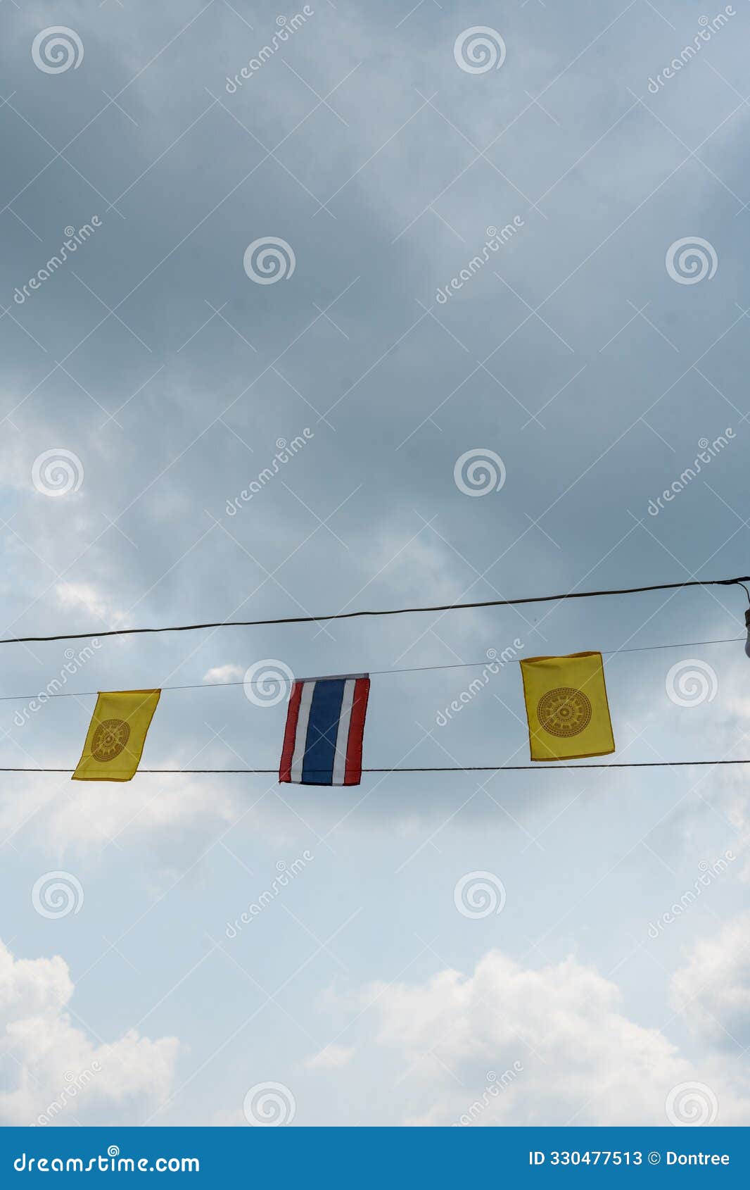 Thai Dharmachakra Buddhist Flags and Thai Nation Flags Waving in the ...