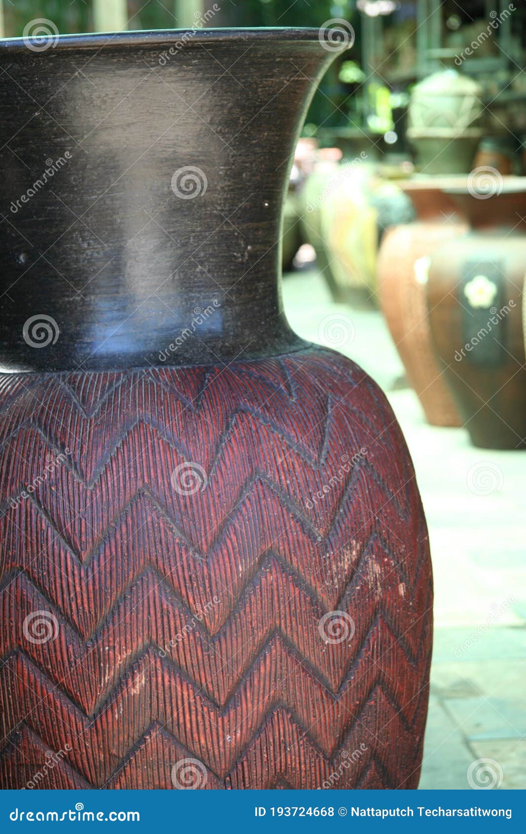 Thai Earthenware Handmade Carved Pots Arranged in a Pattern of Thai Art ...