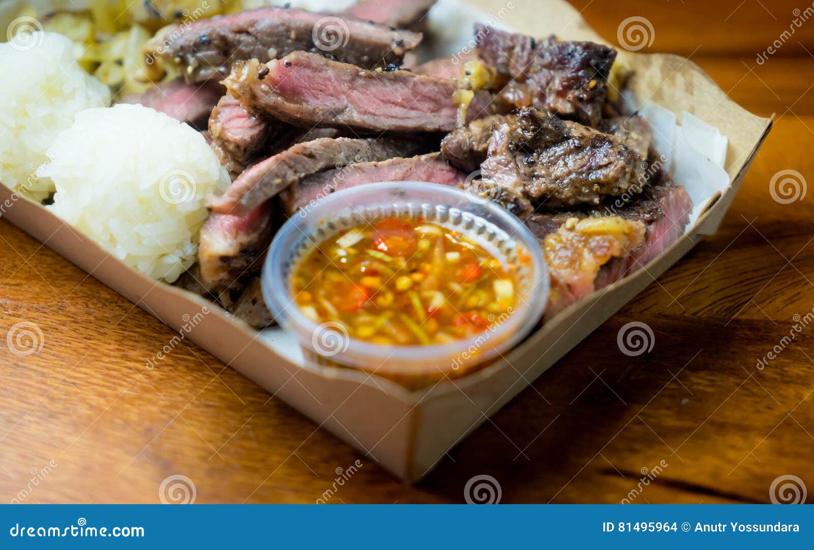 Thai Grilled Beef with Spicy Sauce Sticky Rice. Stock Photo - Image of ...