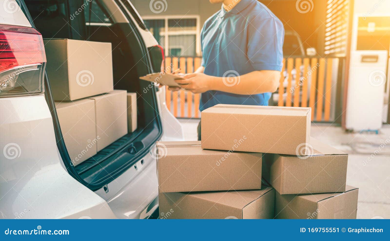 Thai Mailman Checking Parcel and Mail Boxes for Home Delivery. Stock ...
