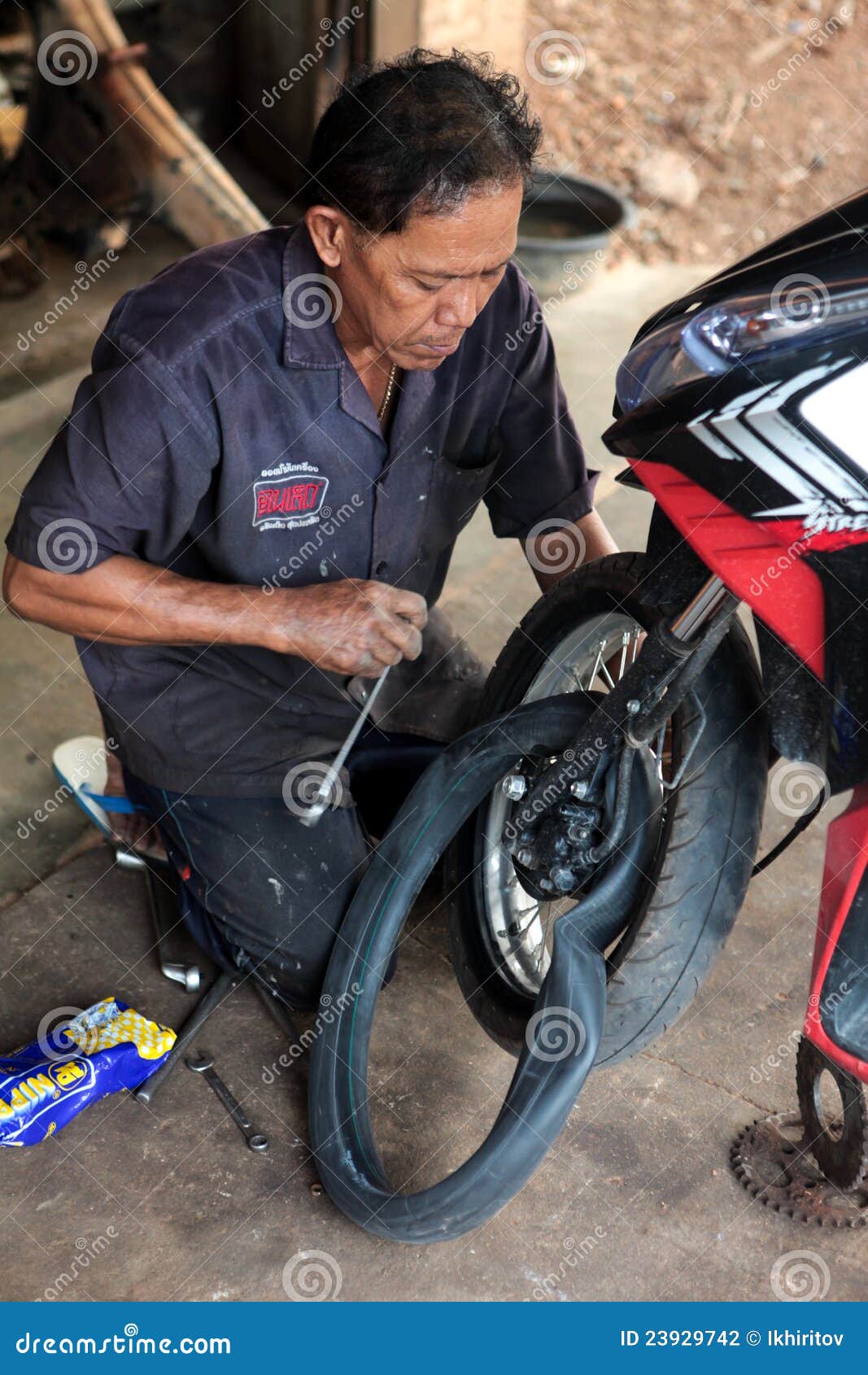 Thai Man Repairing a Motorcycle Editorial Photography - Image of ...