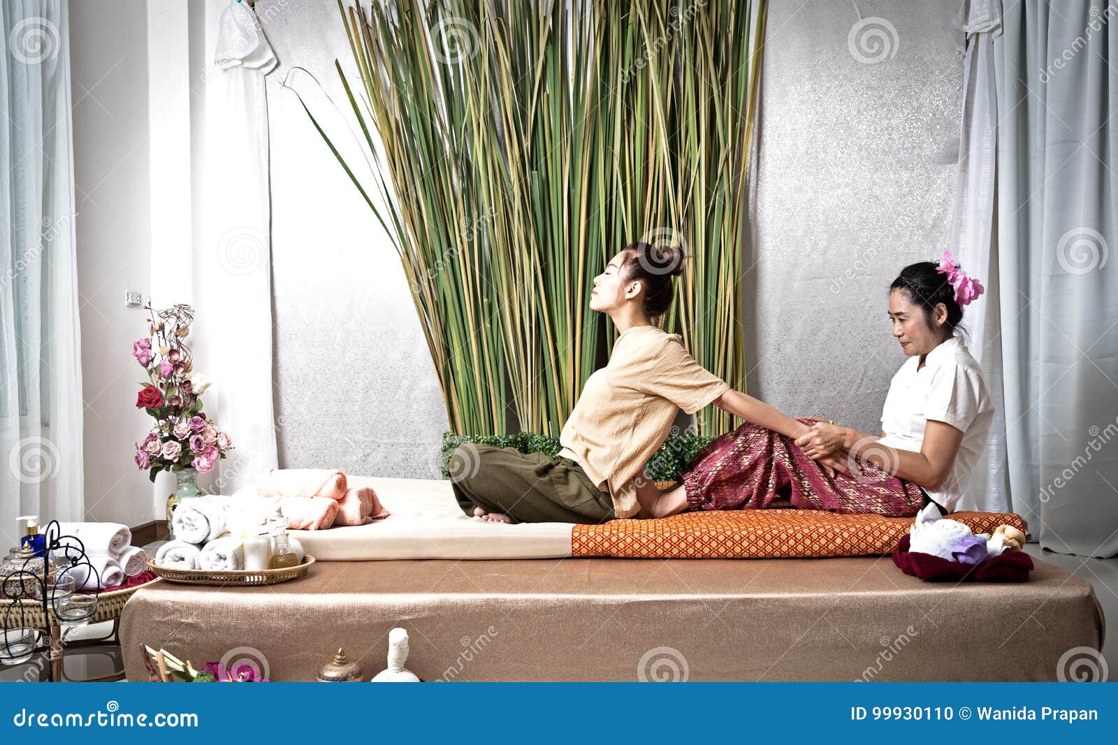 Thai Masseuse Doing Massage For Woman In Spa Salon Asian Beautiful
