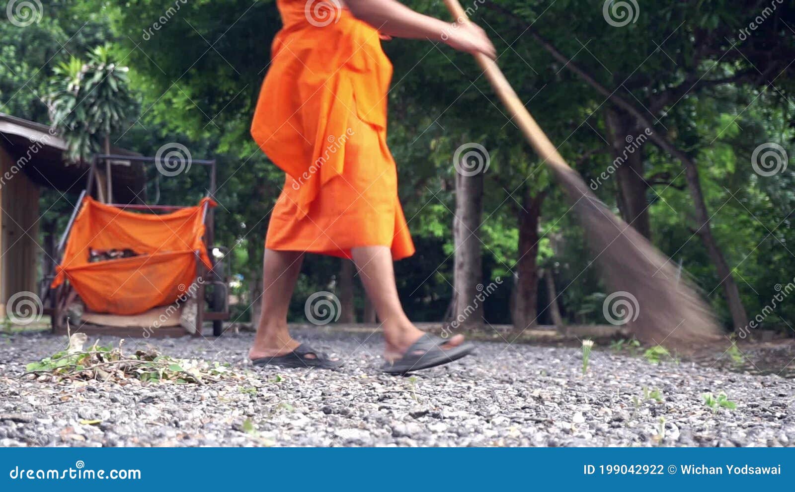 Thai Monks are Sweeping the Temple Grounds on a Rocky Floor Under a ...