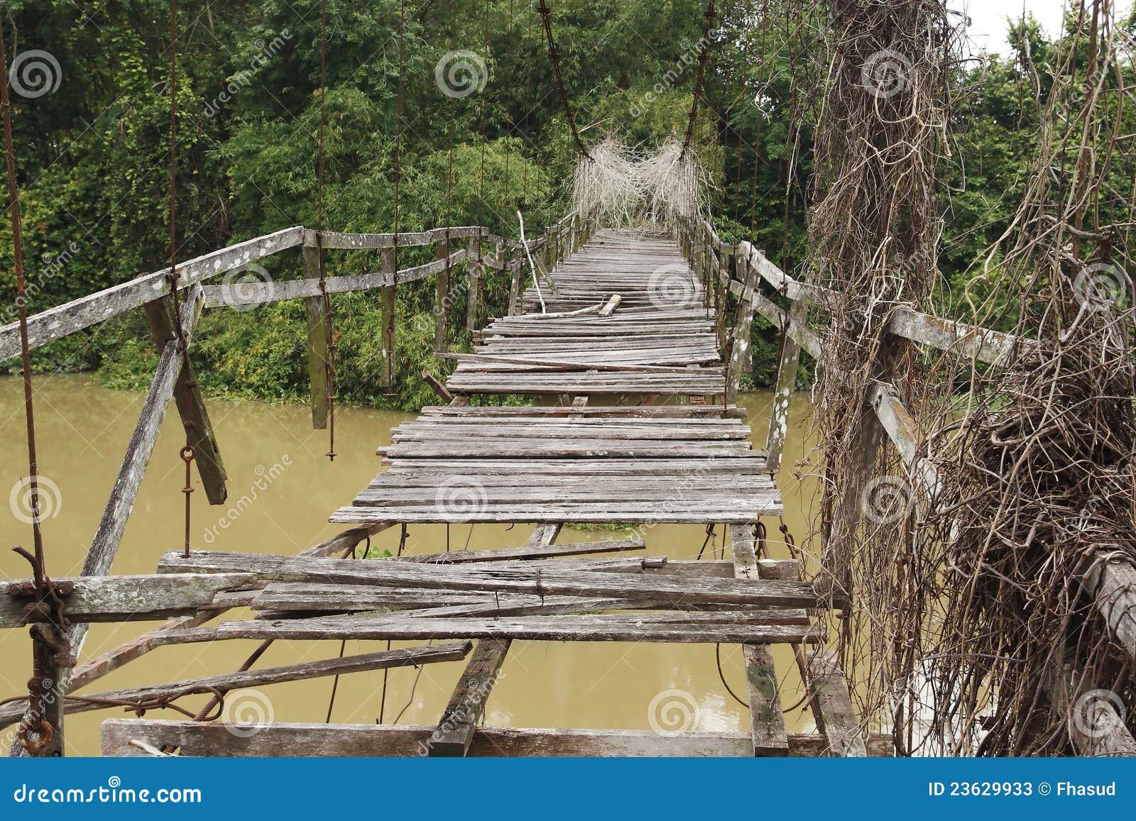 Thai Style Old Wooden Bridge Across River Stock Photos - Image: 23629933