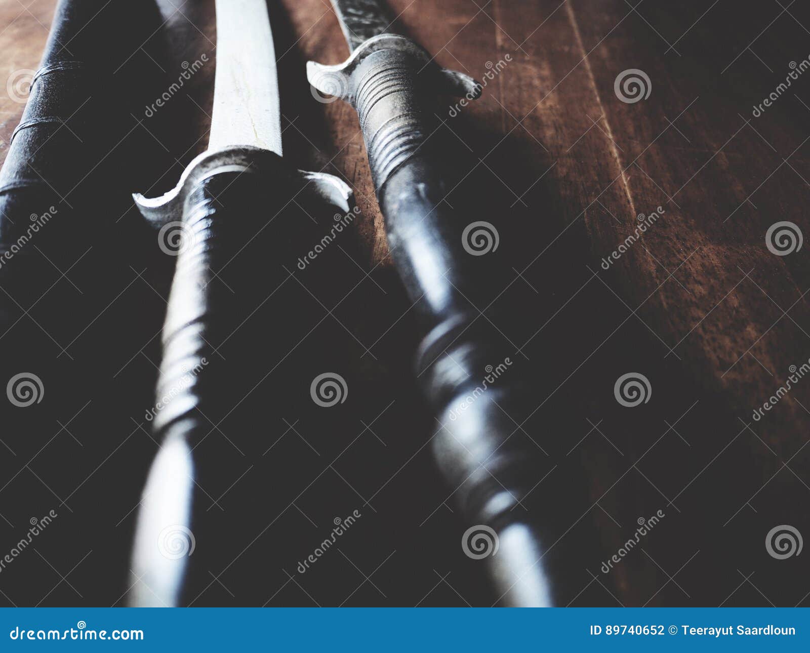Thai sword on wooden table stock photo. Image of retro - 89740652