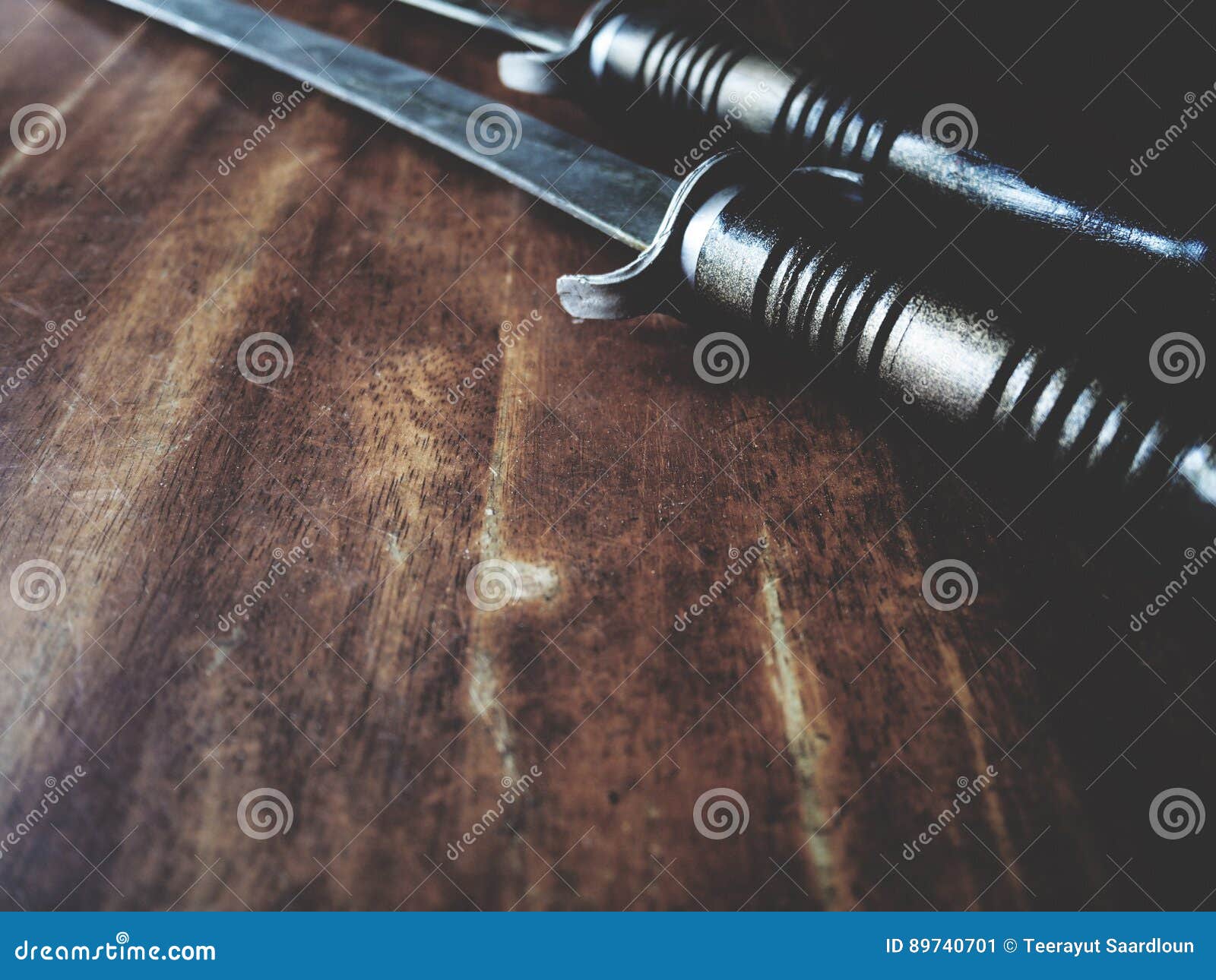 Thai sword on wooden table stock image. Image of traditional - 89740701