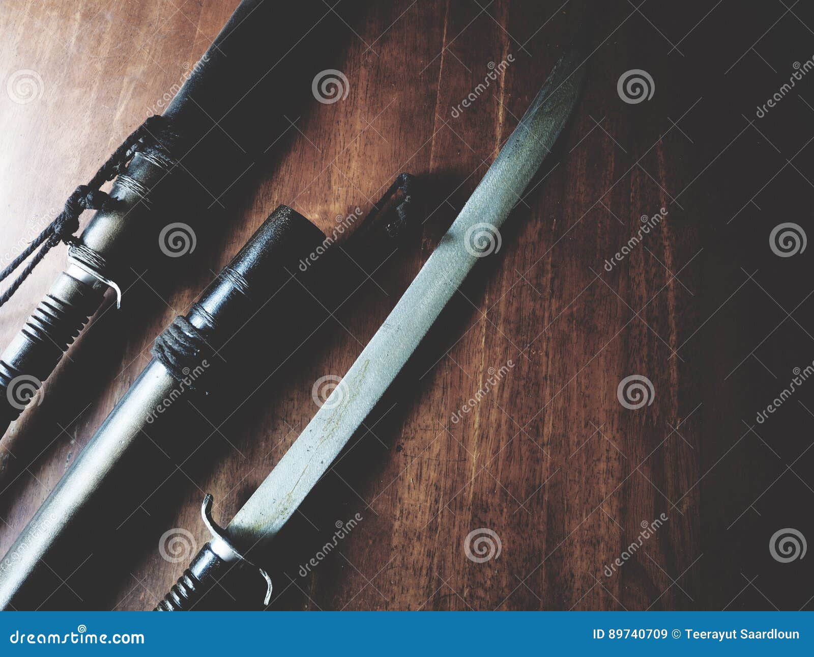 Thai sword on wooden table stock image. Image of traditional - 89740709