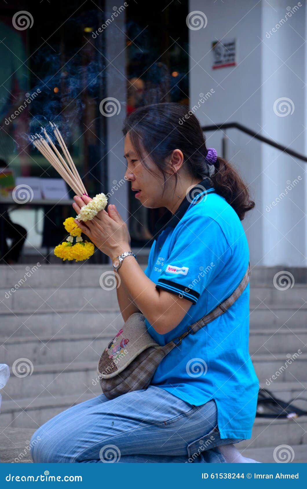 Thai Woman Worships And Prays At Outdoor Shrine Bangkok Thailand