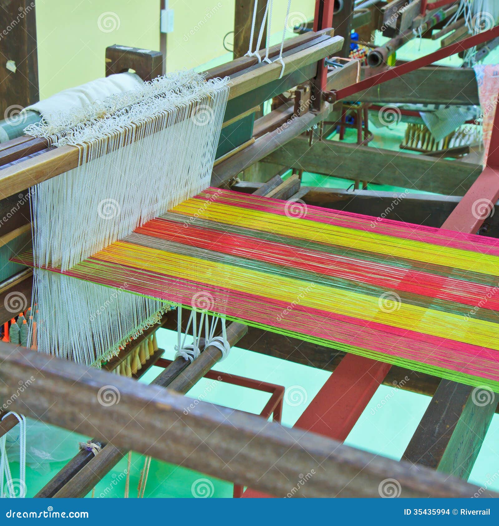 Thai woven silk machine stock photo. Image of clothing - 35435994