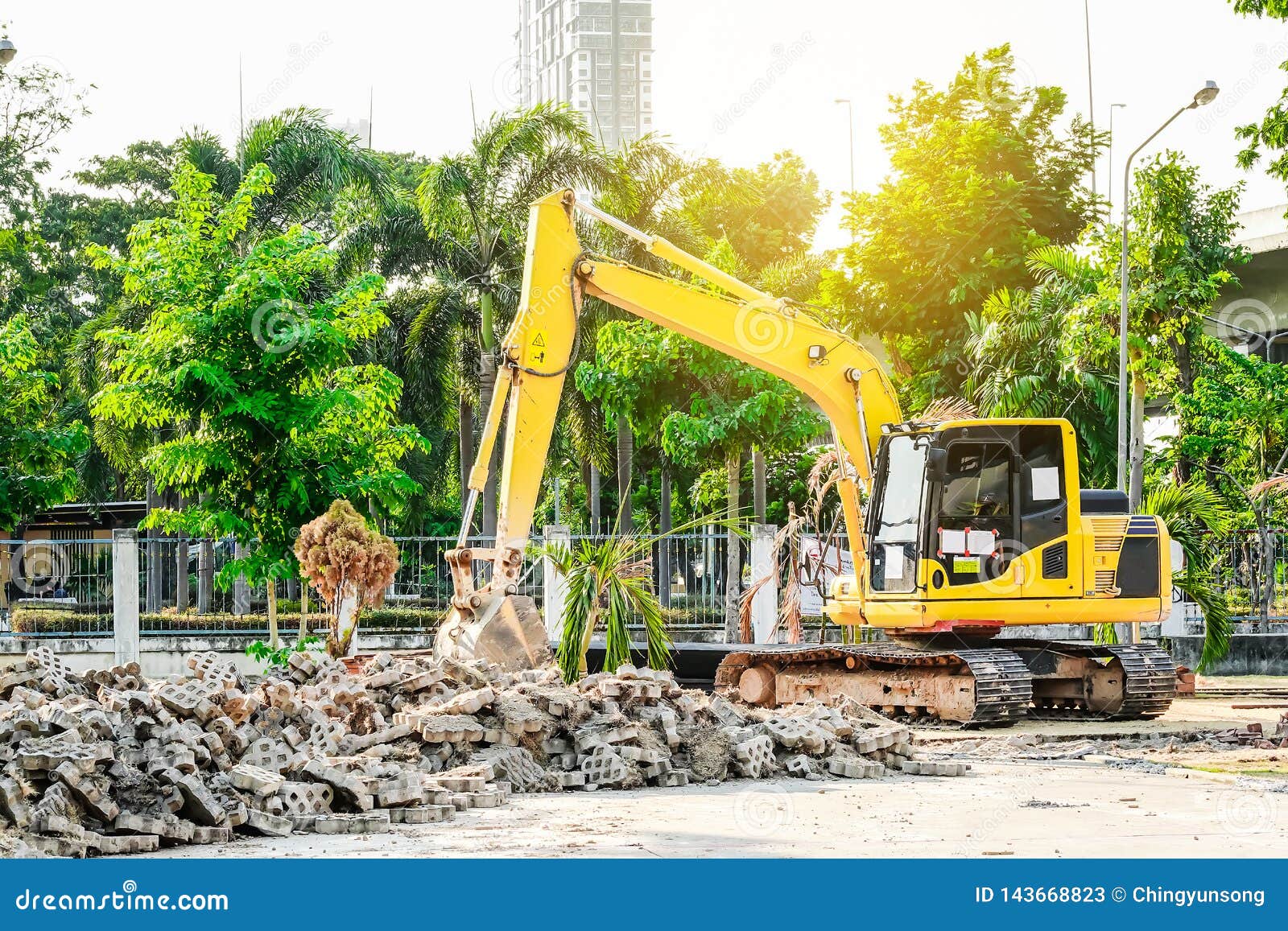 Modern Excavator Performs Excavation Work on the Construction Site ...