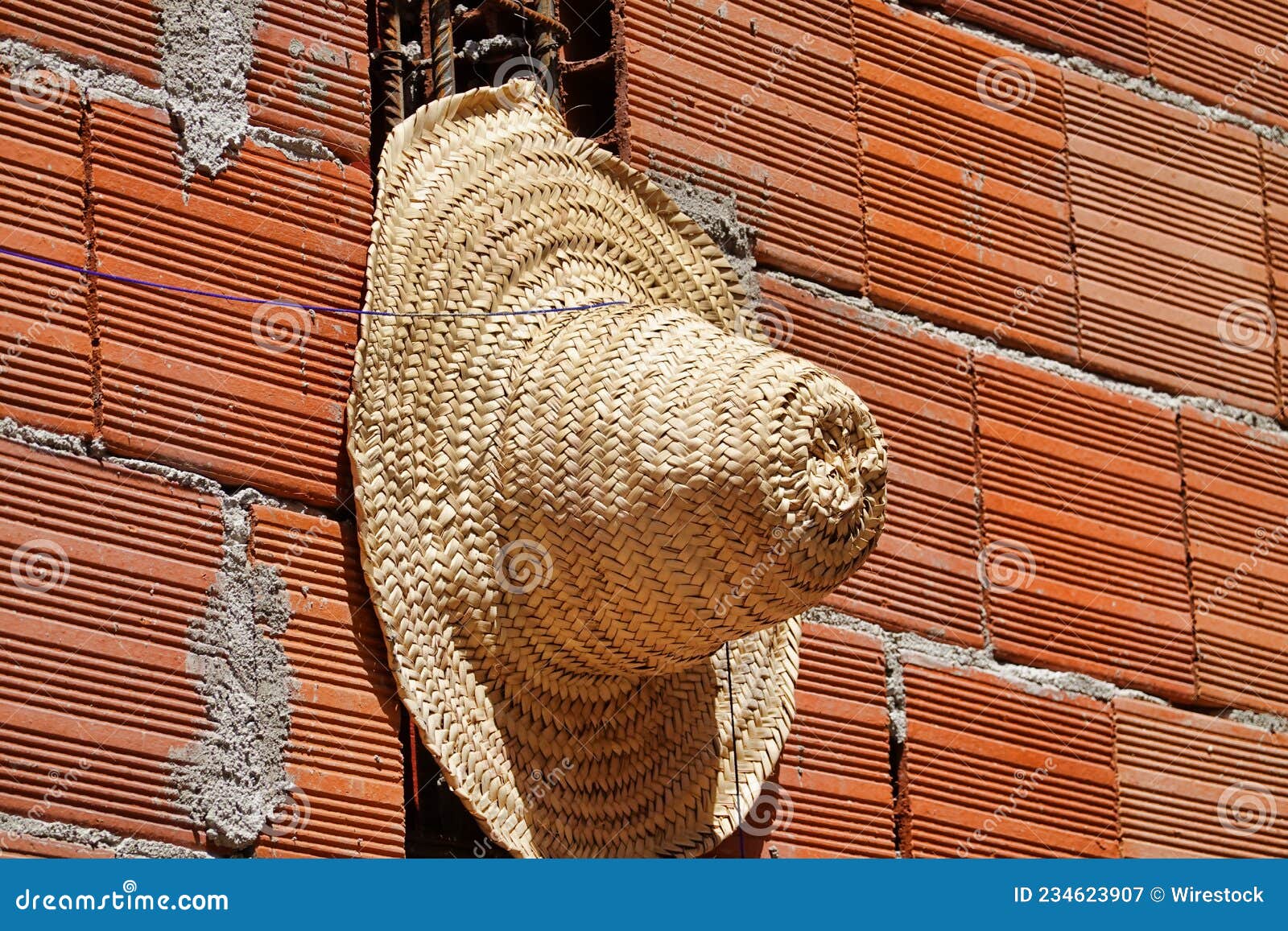 Thatch Hat Hanging on the Brick Wall Stock Image - Image of urban ...