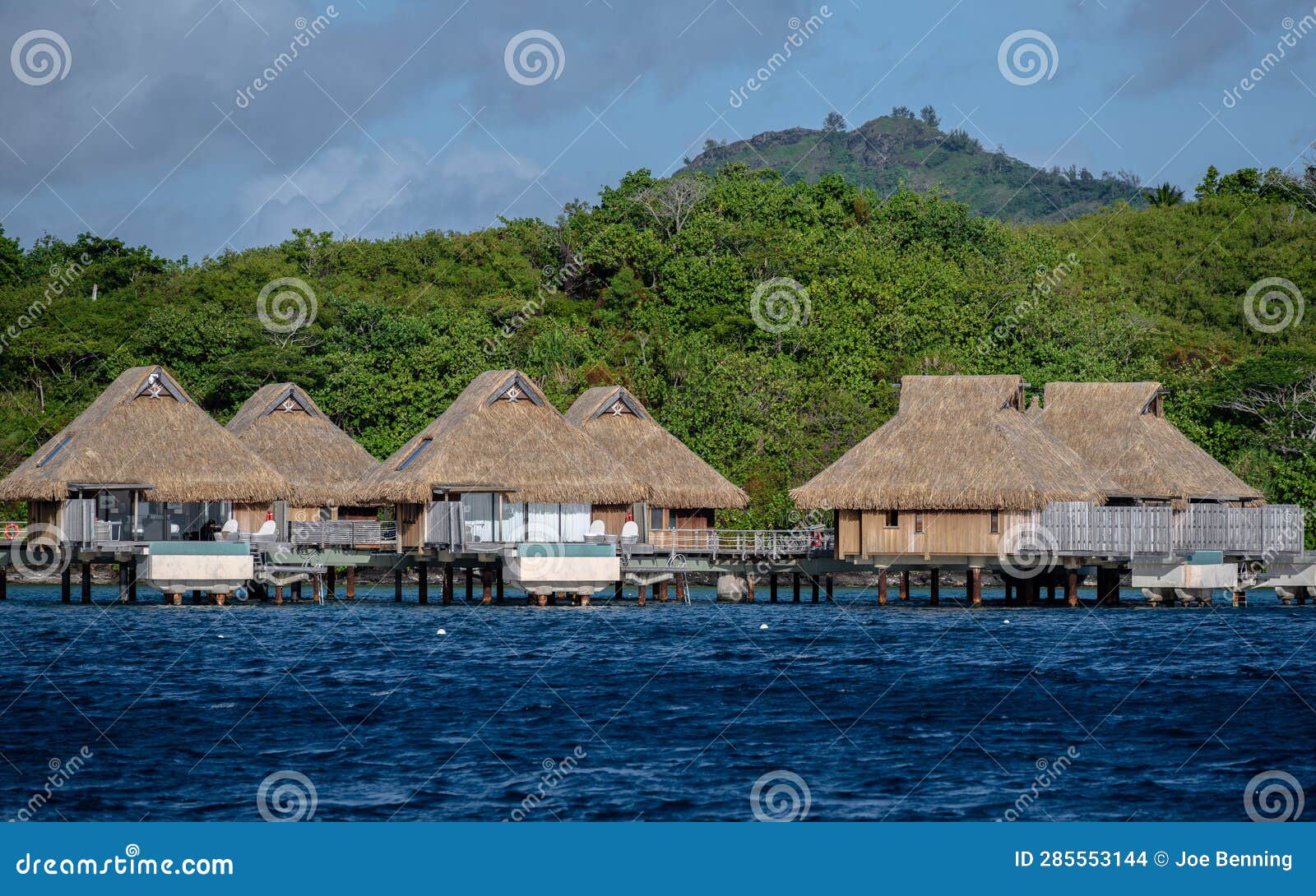 Thatched Huts over Water stock photo. Image of summer - 285553144