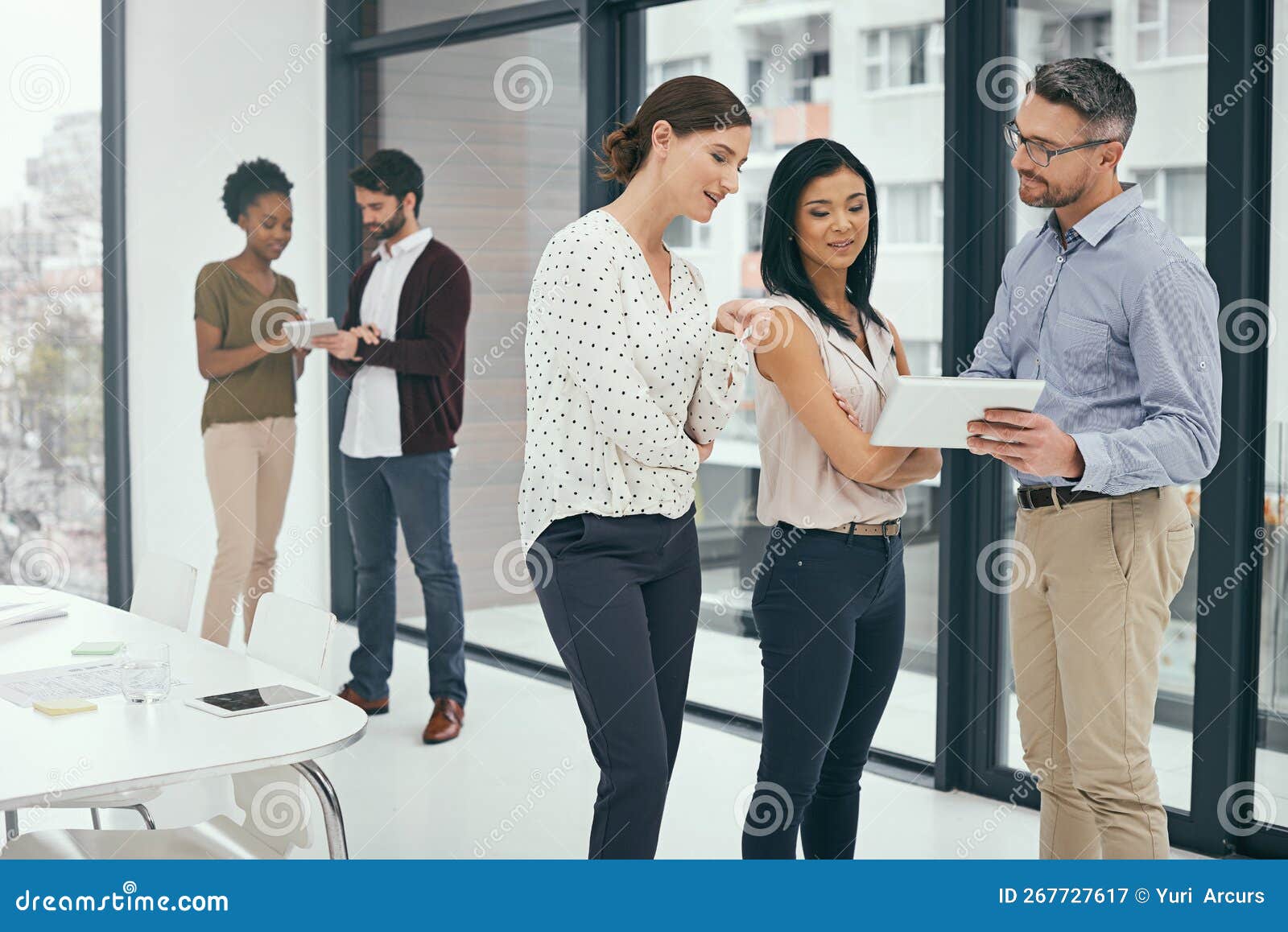 Their Updates are Looking Great so Far. a Group of Colleagues Working ...