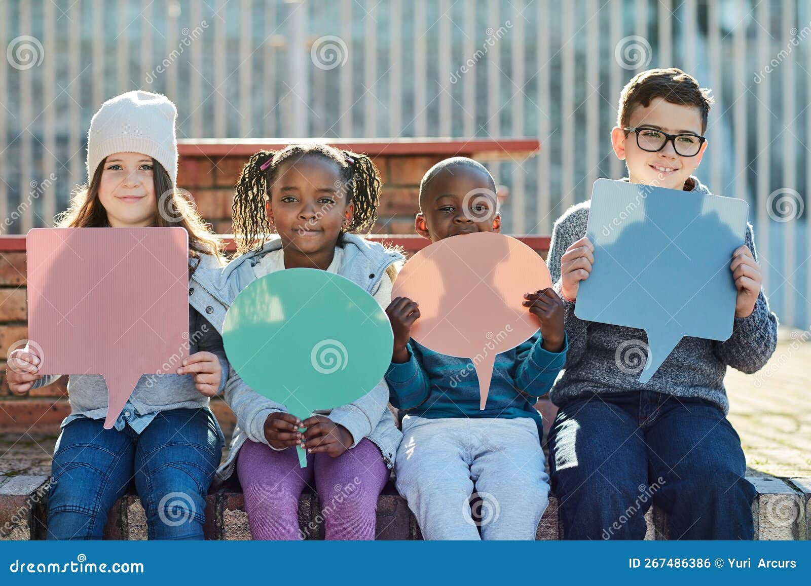 Their Words Matter. Elementary School Kids Holding Up Speech Bubbles ...