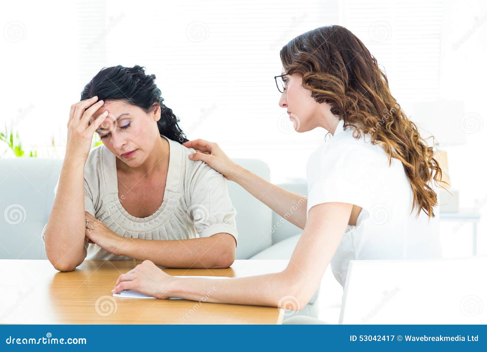 Therapist Comforting Upset Woman On Sofa Stock Image | CartoonDealer ...