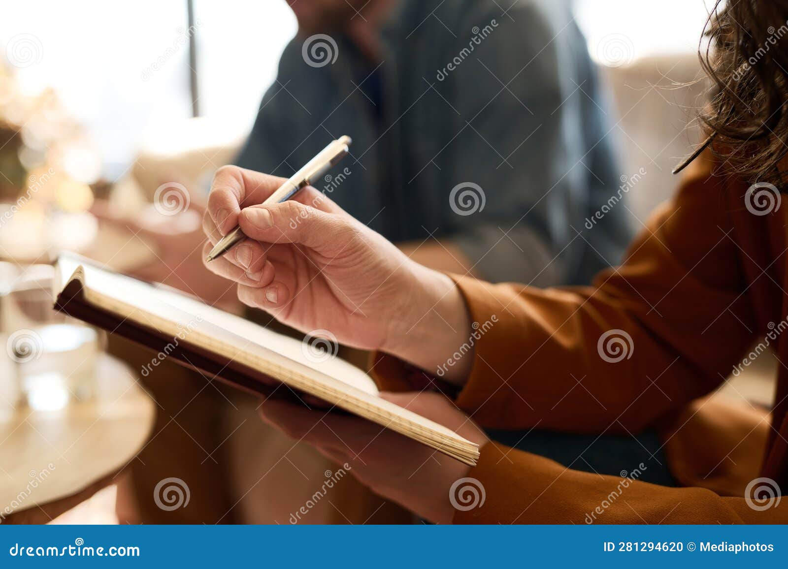 Therapist Making Notes in Notepad Stock Photo - Image of talk ...