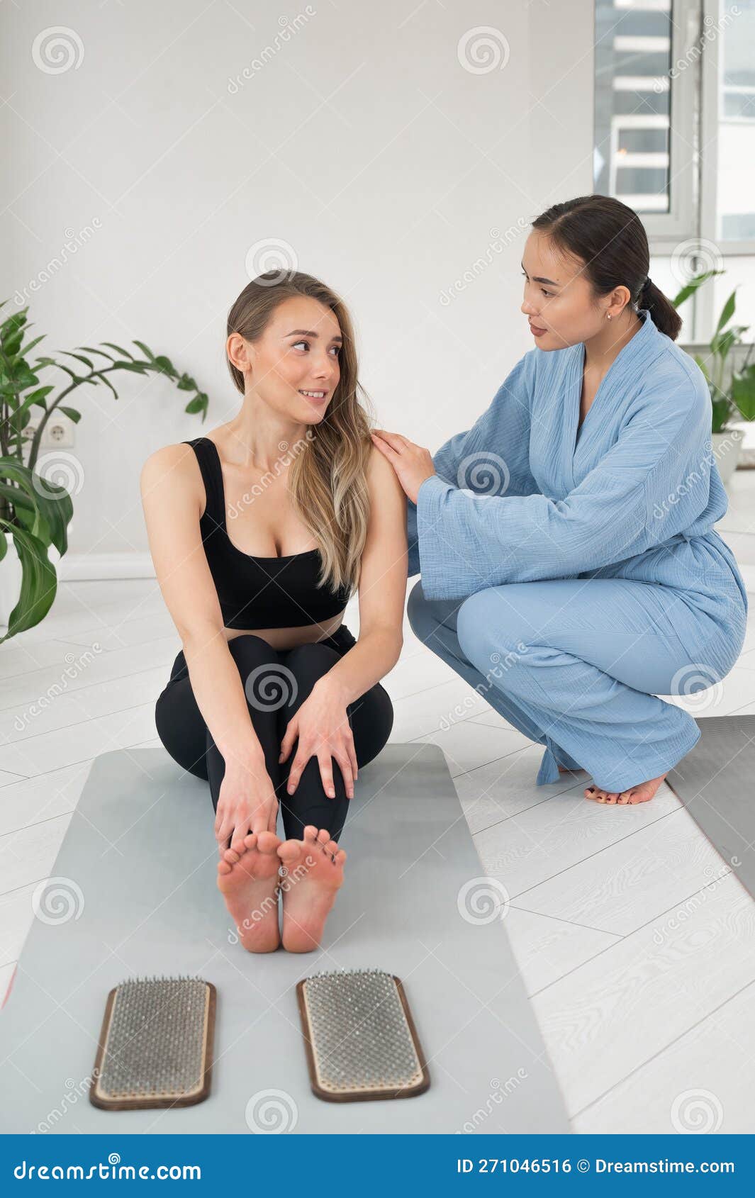 The Therapist Supports the Client after Standing on the Sadhu Boards ...