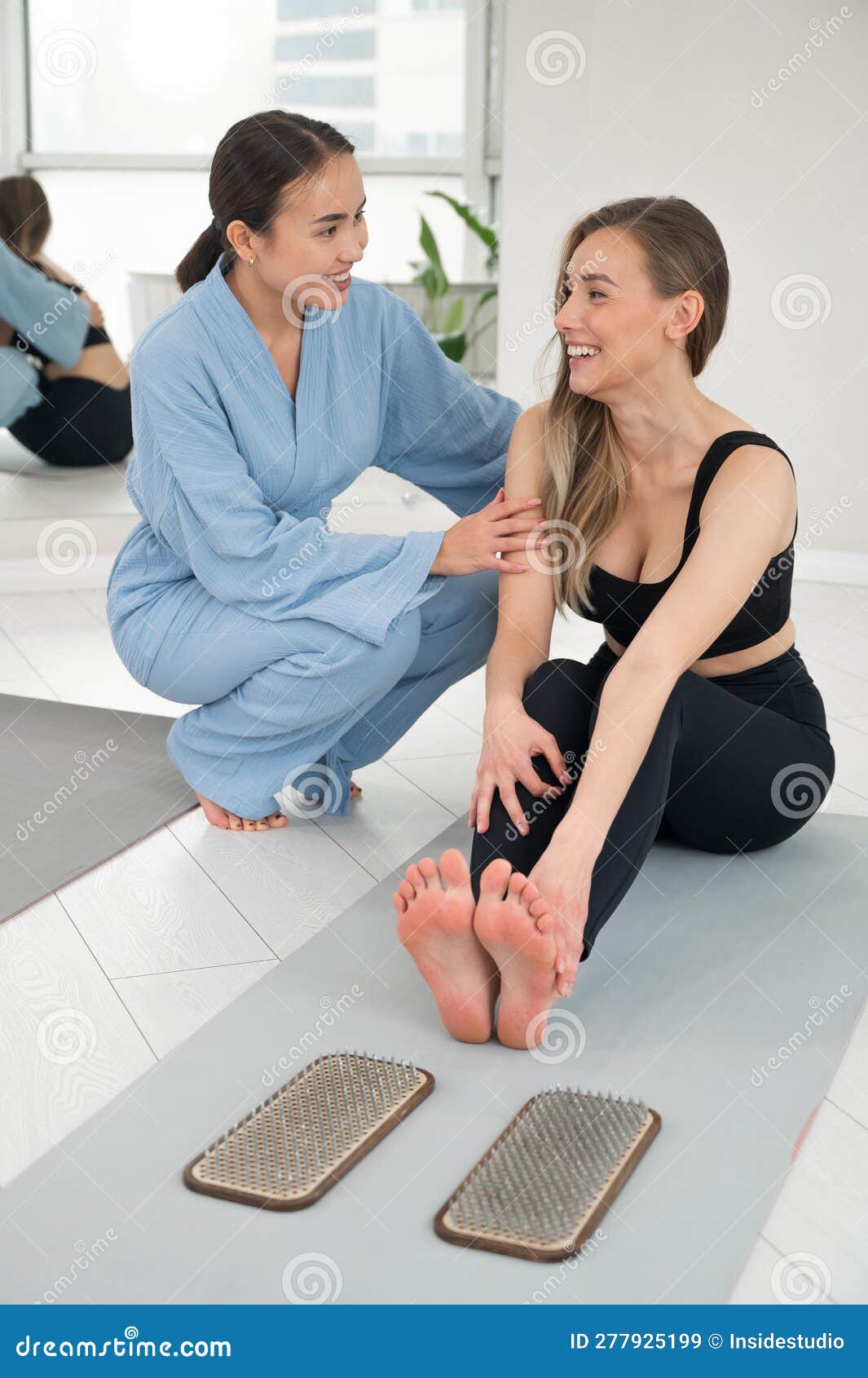 The Therapist Supports the Client after Standing on the Sadhu Boards ...