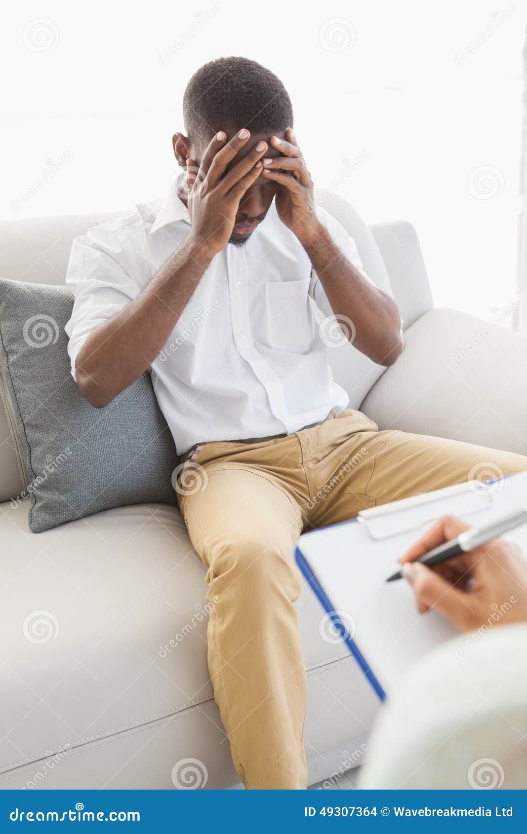 Therapist Taking Notes on Her Upset Patient Stock Photo - Image of ...