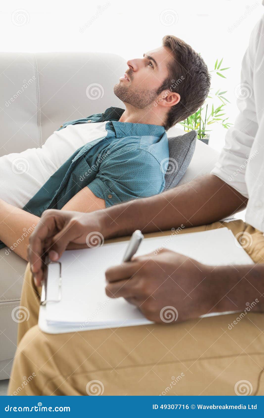 Therapist Taking Notes on His Worried Patient Stock Photo - Image of ...