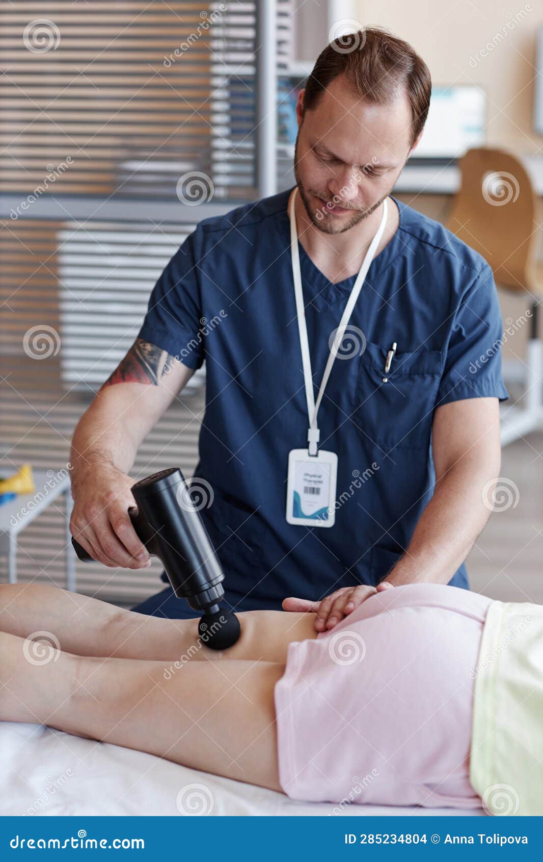 Therapist Using Massager To Massage Patient Stock Photo - Image of ...