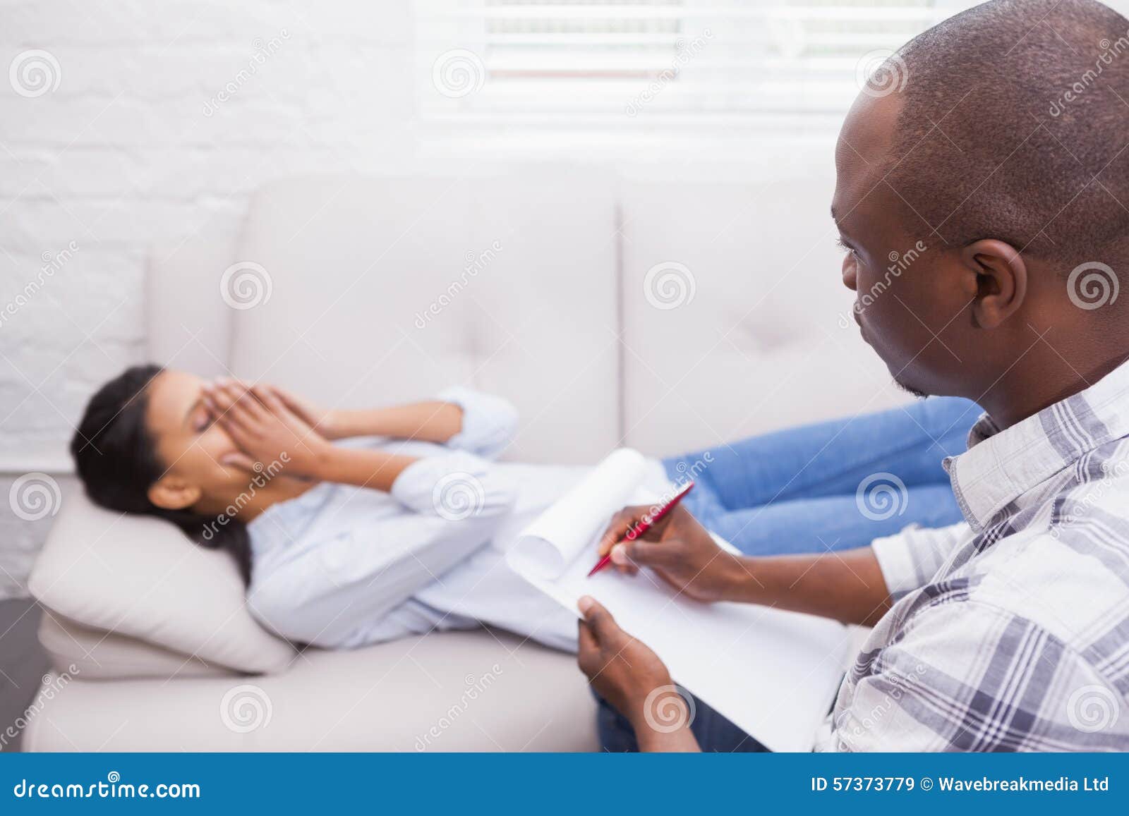 Therapist Writing Notes on His Crying Patient on the Couch Stock Image ...