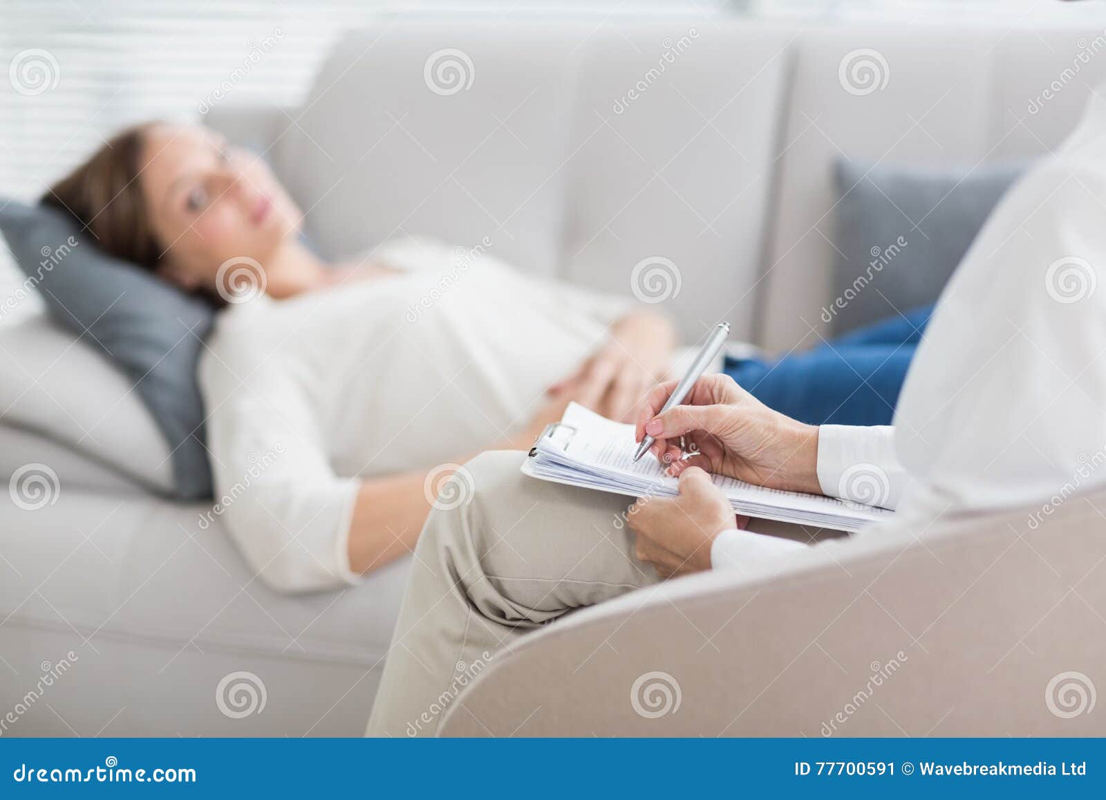 Therapist Writing Notes of Patient Stock Image - Image of female, home ...