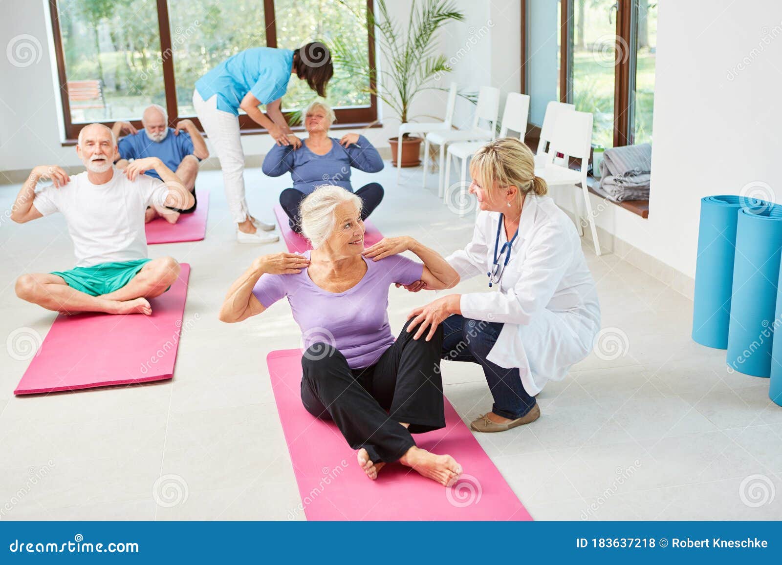 Therapists Help Seniors with Rehab Exercise Stock Photo - Image of ...