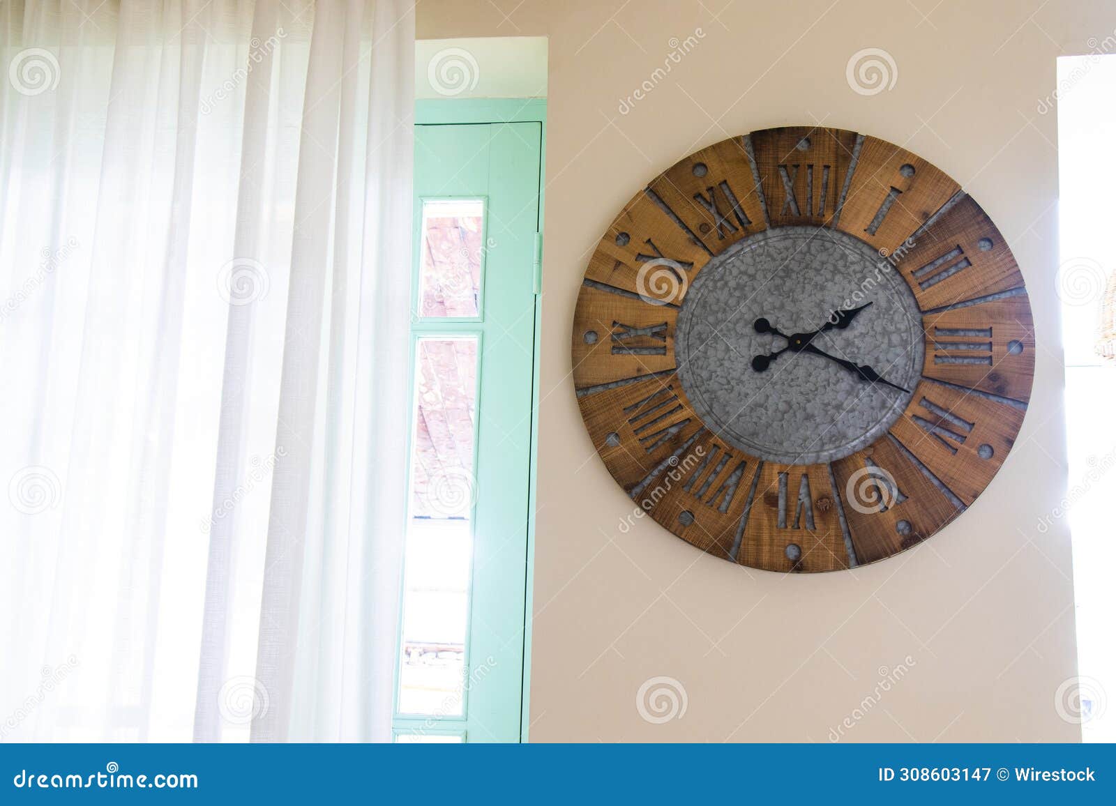 There is a Big Clock Mounted on the Wall by a Window Stock Image ...