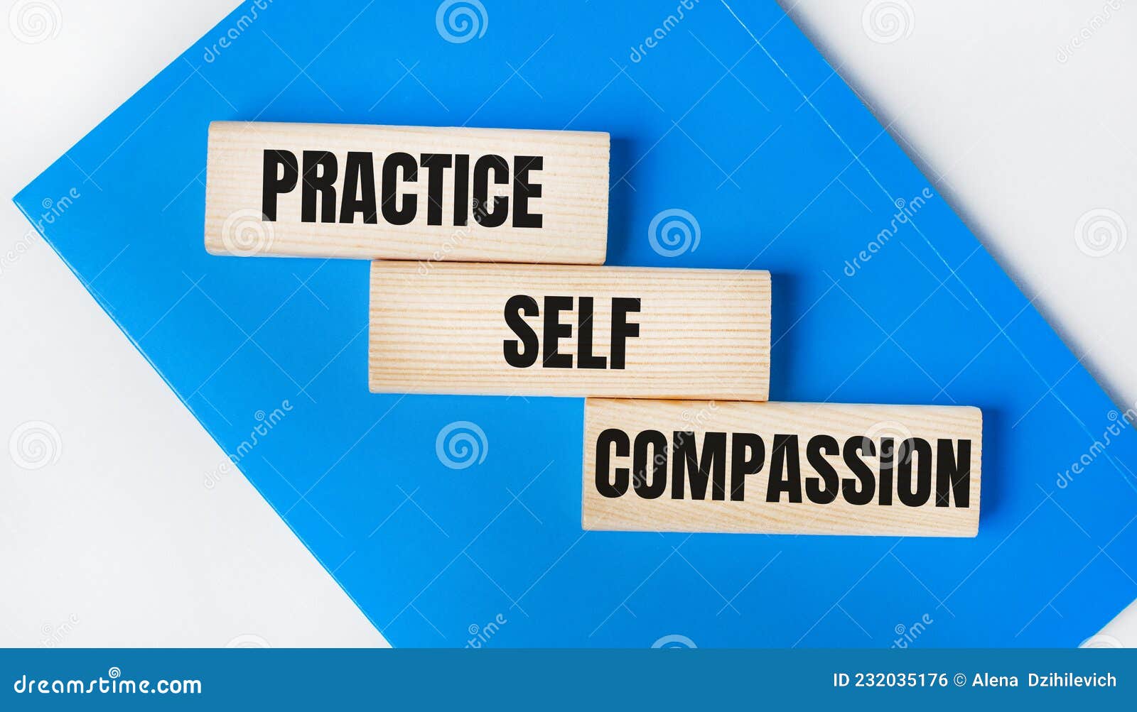 There is a Blue Notebook on a Light Gray Background. Above are Three ...