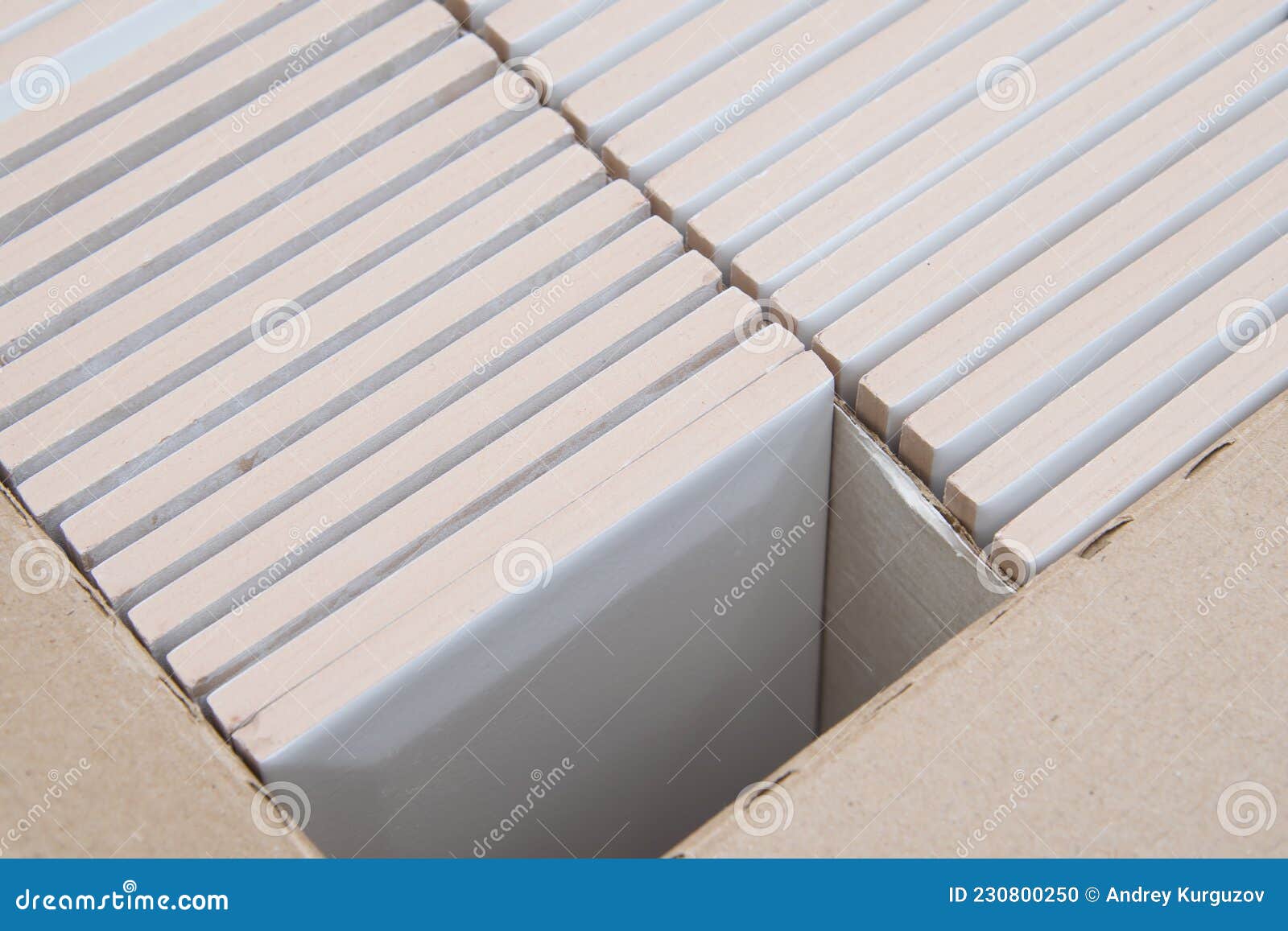 There is a Ceramic Tile in a Cardboard Box, Folded in a Row, Close-up ...