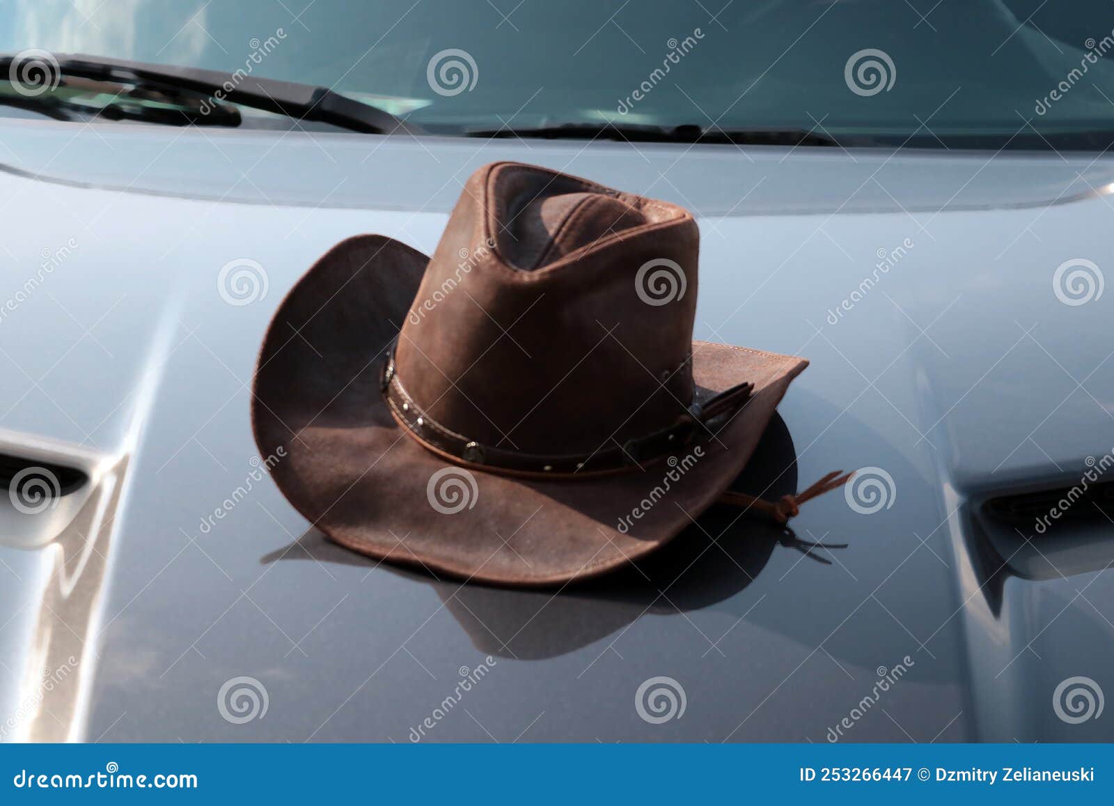 There is a Cowboy Hat on the Hood of the Car. Stock Image - Image of ...
