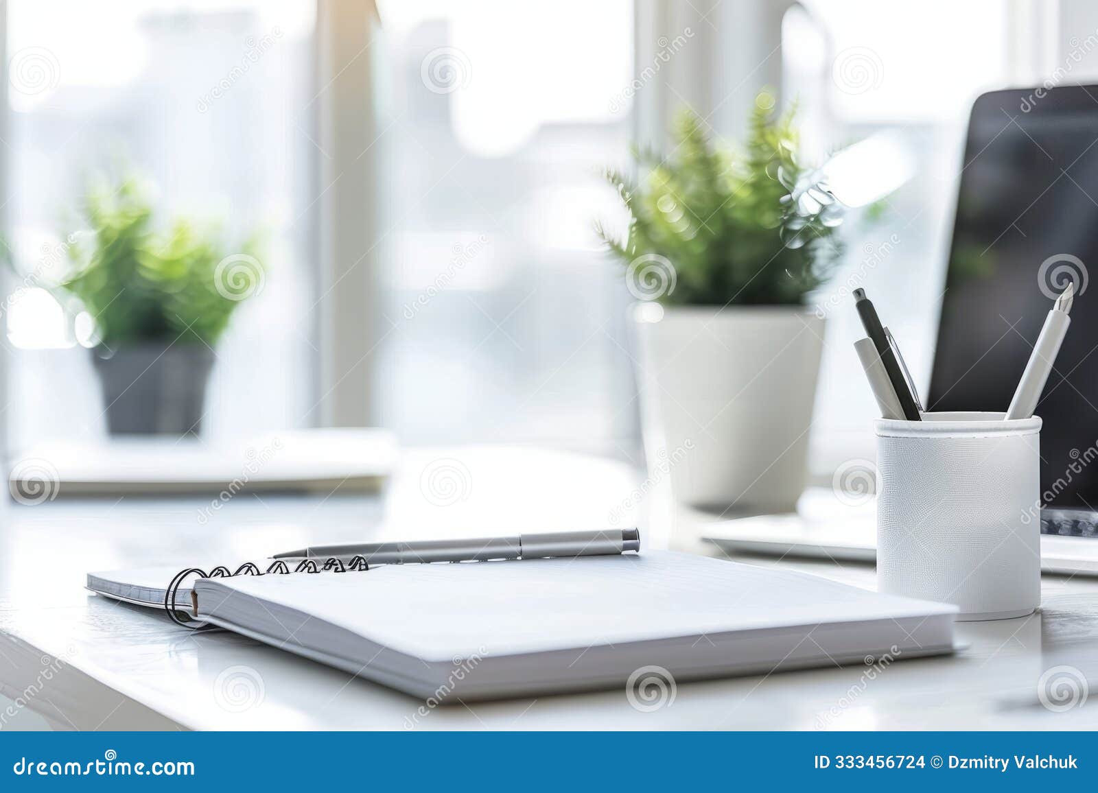 There is an Empty Notepad and Pen on the Table, a Workplace in the ...