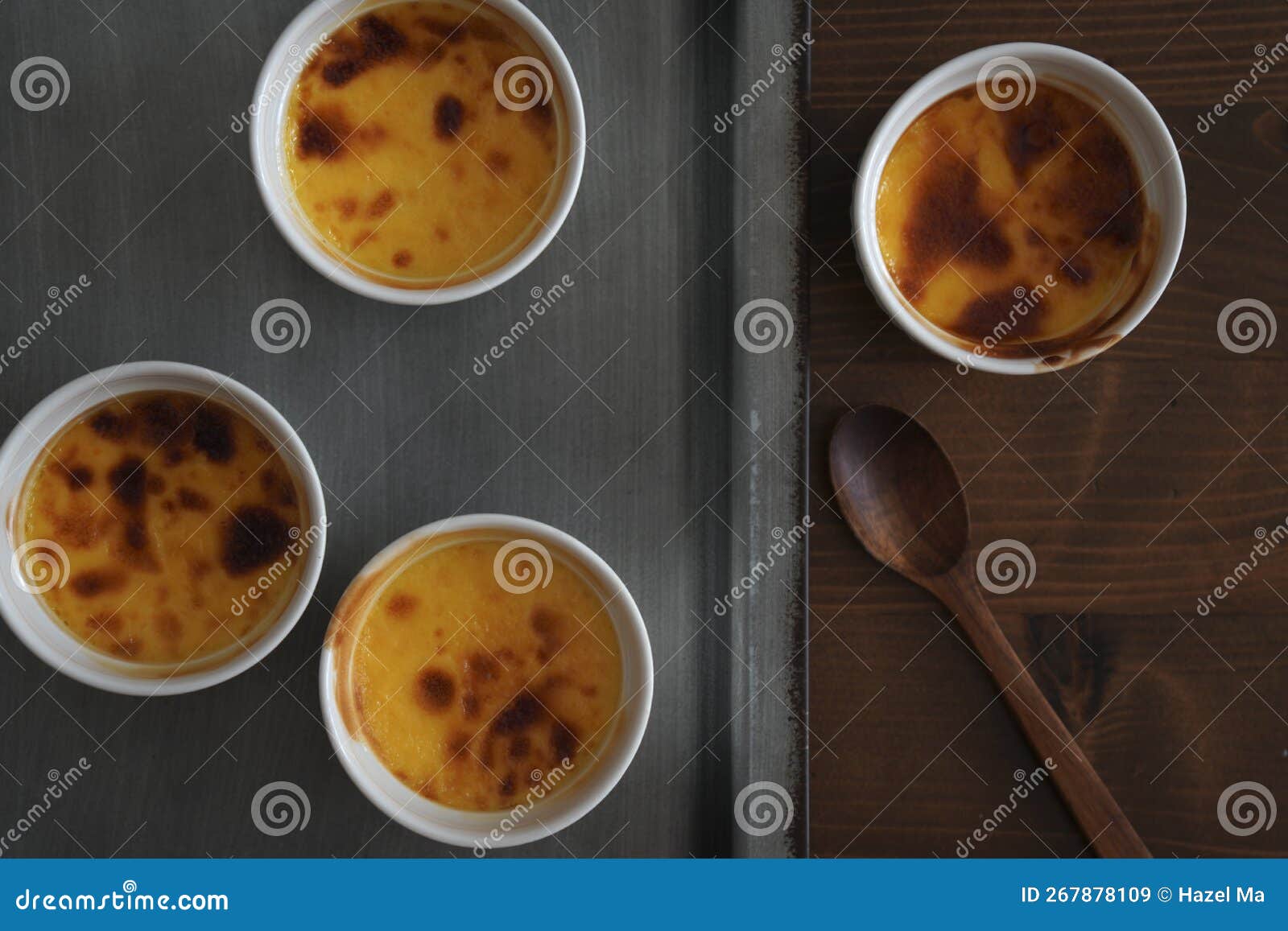 There are Four Delicious Freshly Baked Egg Puddings on the Plate Stock ...