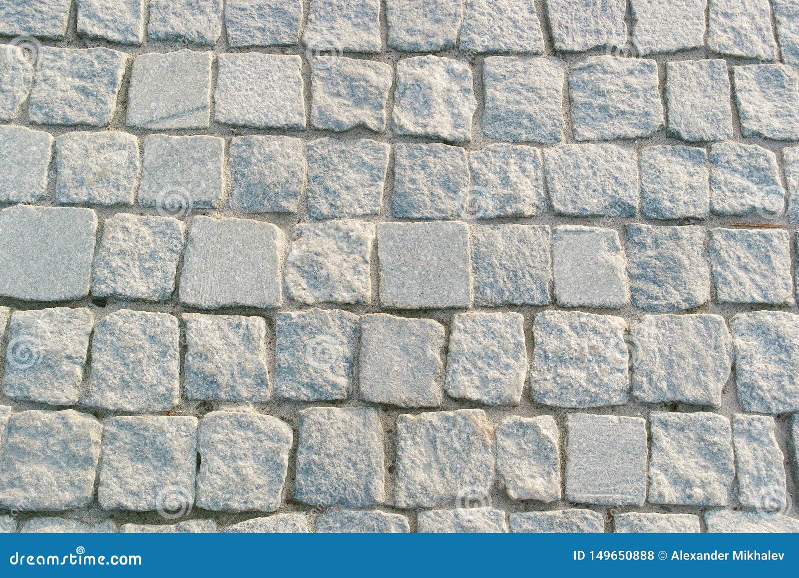 Gray paving stones on road stock photo. Image of cobblestone - 149650888
